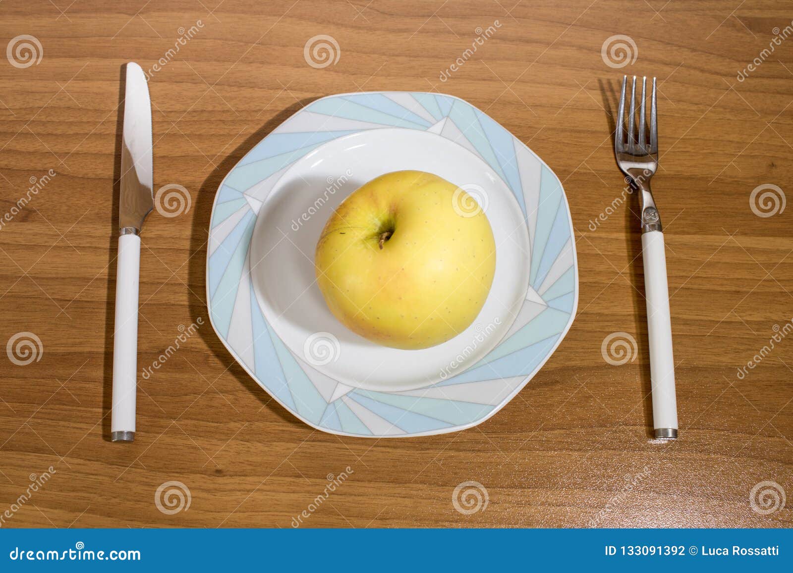 Apple Fruit on a Porcelain Plate on a Table Stock Photo - Image of ...