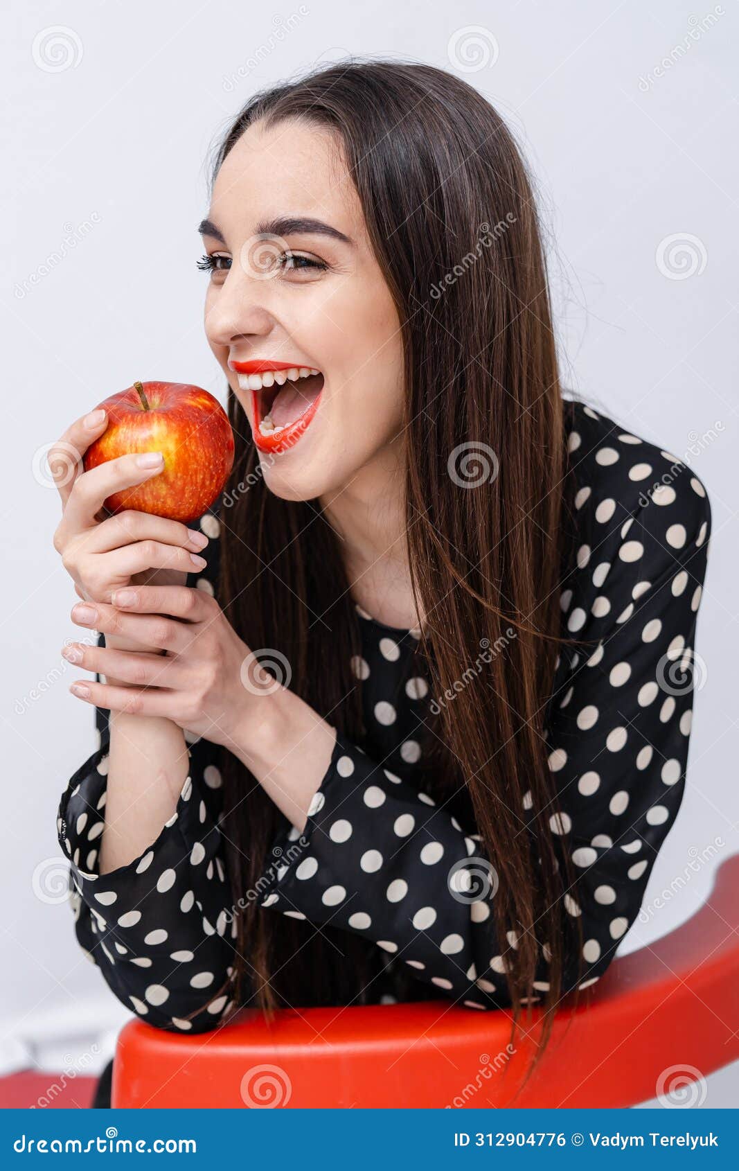Apple in Girls Hands. Smiling Girl Biting an Apple Stock Photo - Image ...