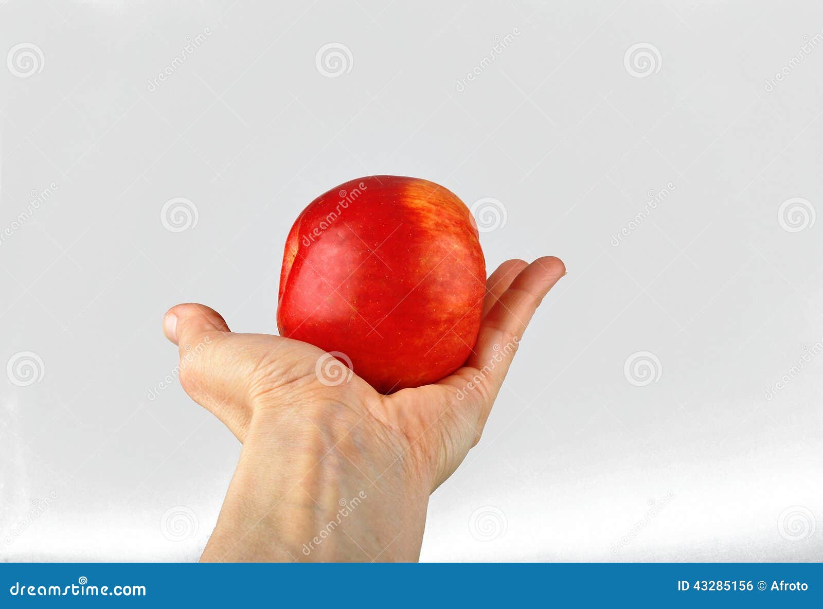 Apple in a hand stock photo. Image of nutritious, fresh - 43285156