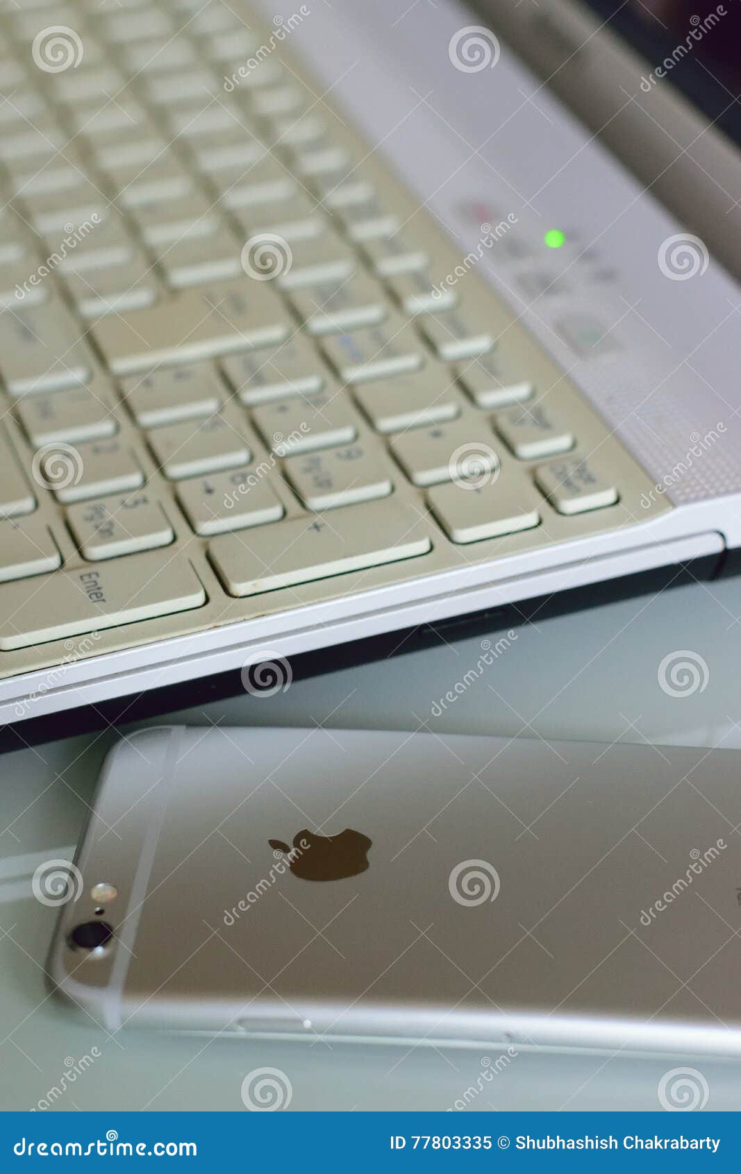 Apple IPhone on Desk with Laptop Editorial Image - Image of desk ...