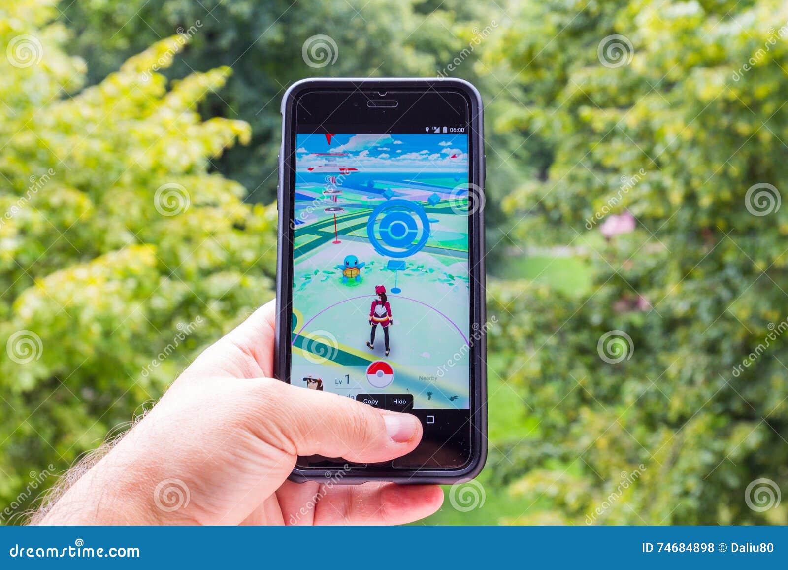 Apple IPhone6 Plus Held in One Hand Showing Its Screen with Pokemon Go ... Apple IPhone6 Plus Held in One Hand Showing Its Screen with Pokemon Go ...