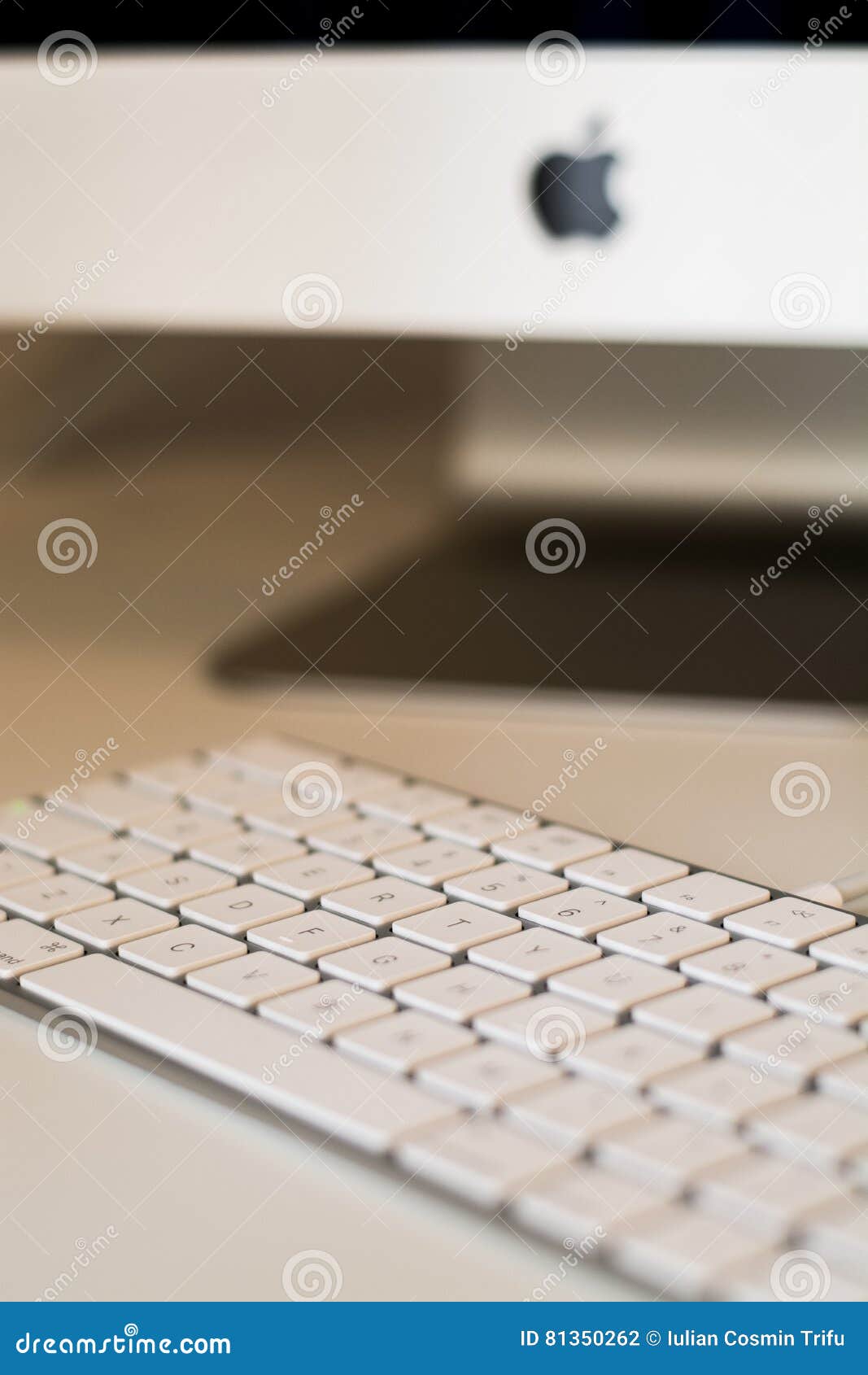 Apple Keyboard with Blurred Monitor in the Background Editorial ...
