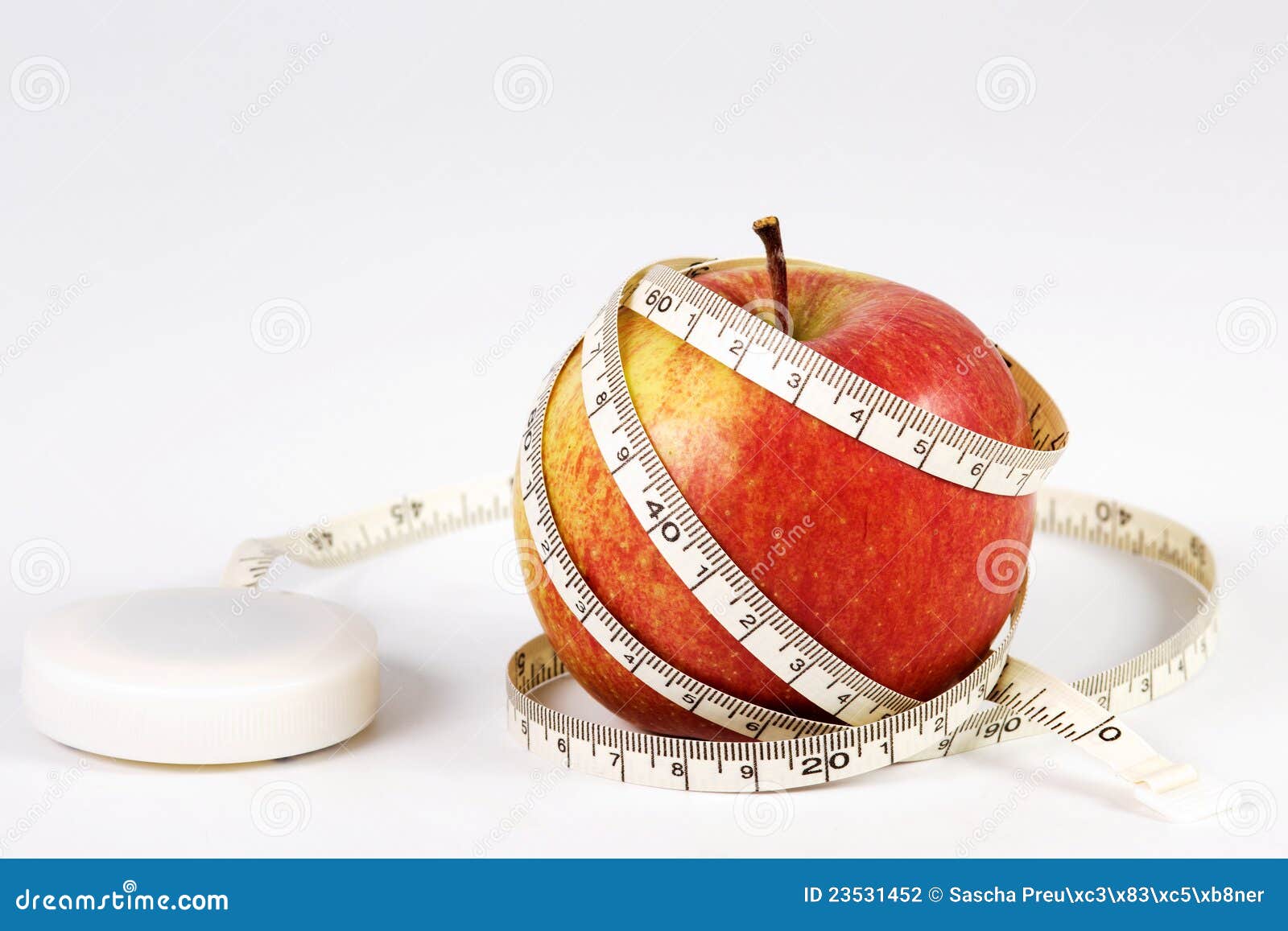 Apple with measuring tape stock photo. Image of mass - 23531452