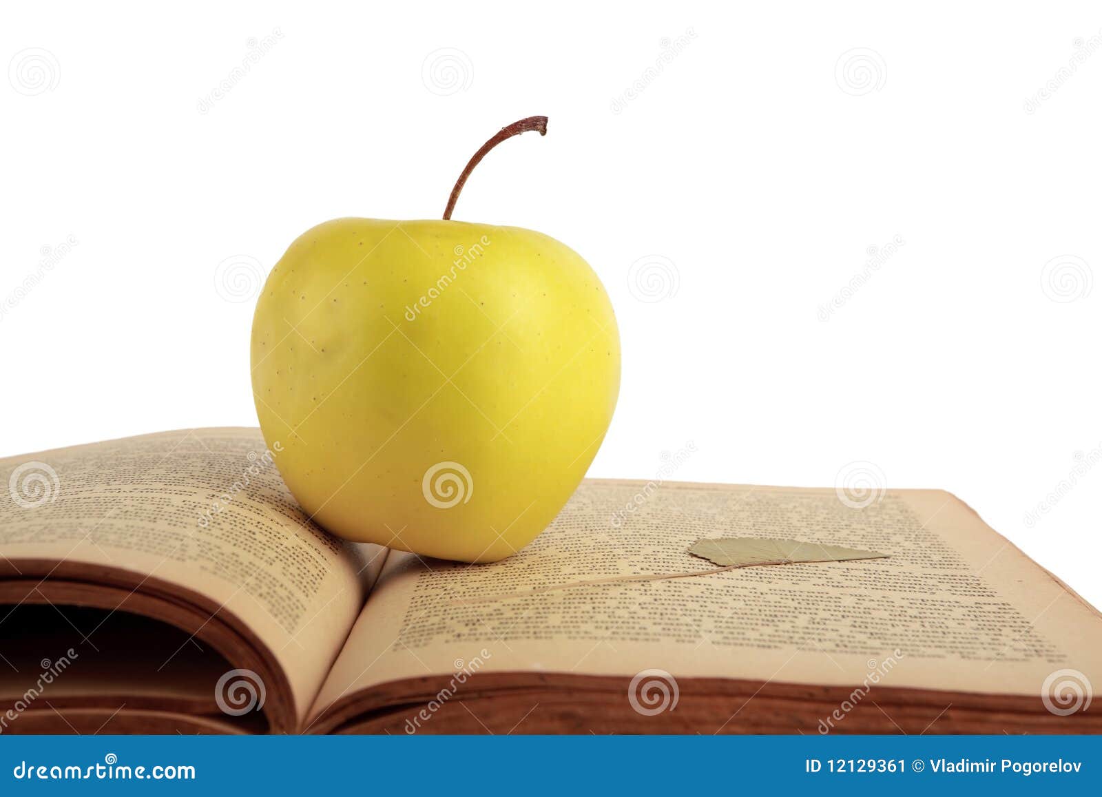 Apple and old book stock image. Image of study, yellow - 12129361