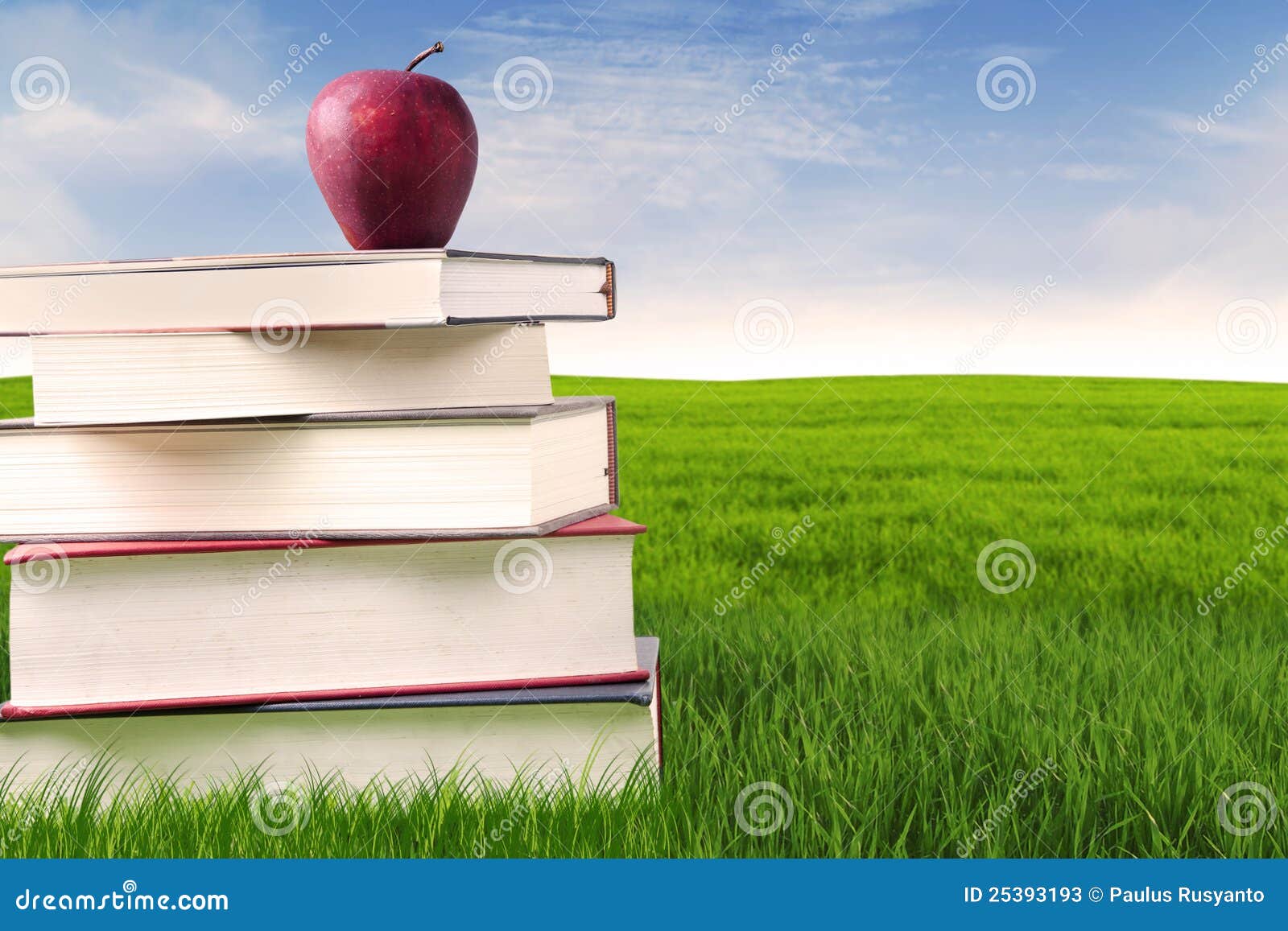 An Apple Over Stack of Books Outdoor Stock Image - Image of green ...