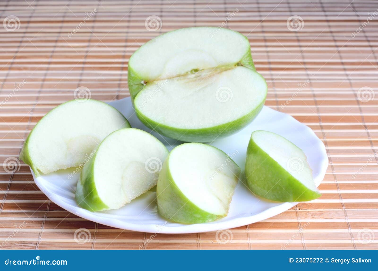 Apple pieces on the plate stock photo. Image of saucer - 23075272