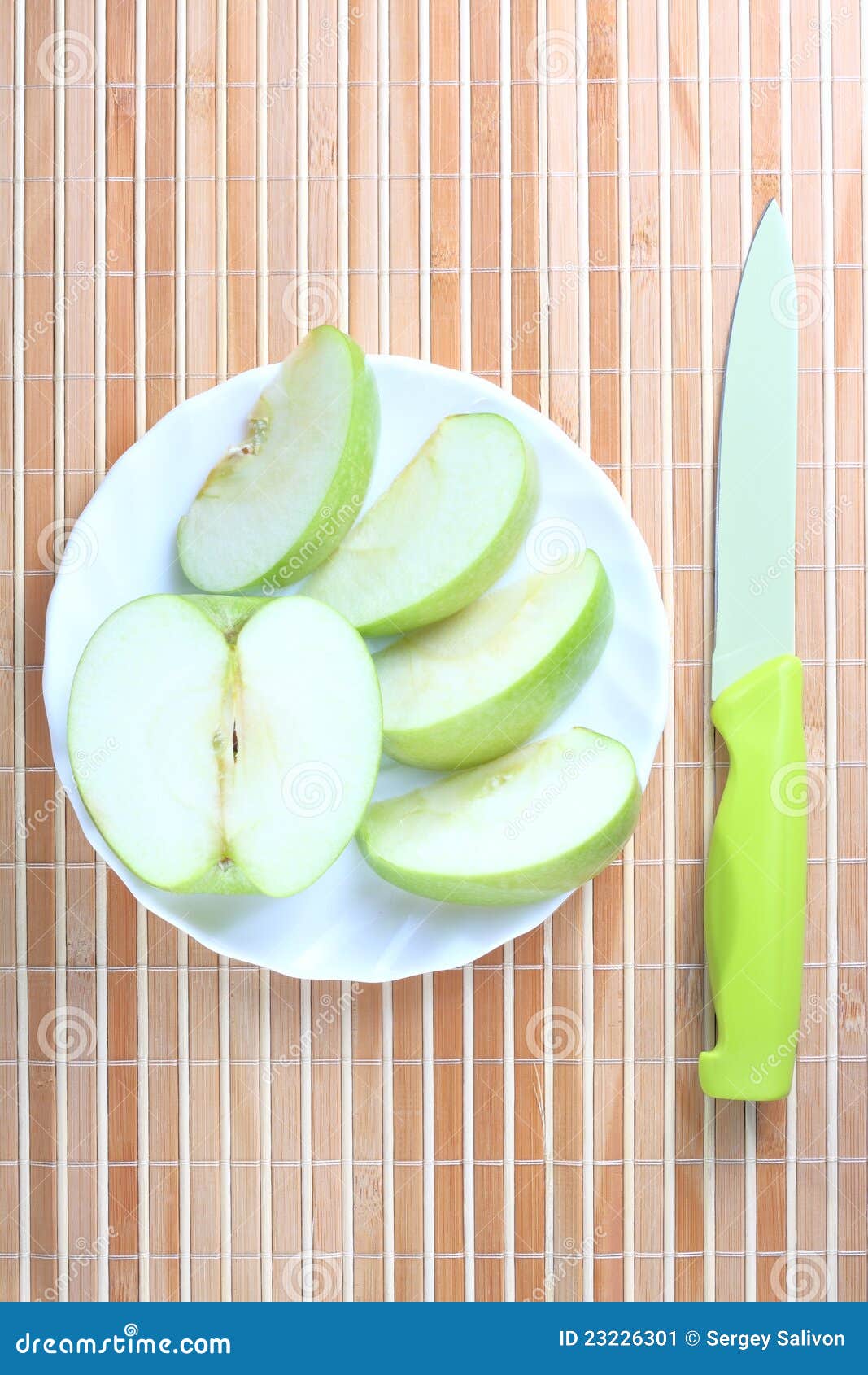 Apple pieces on the plate stock image. Image of white - 23226301