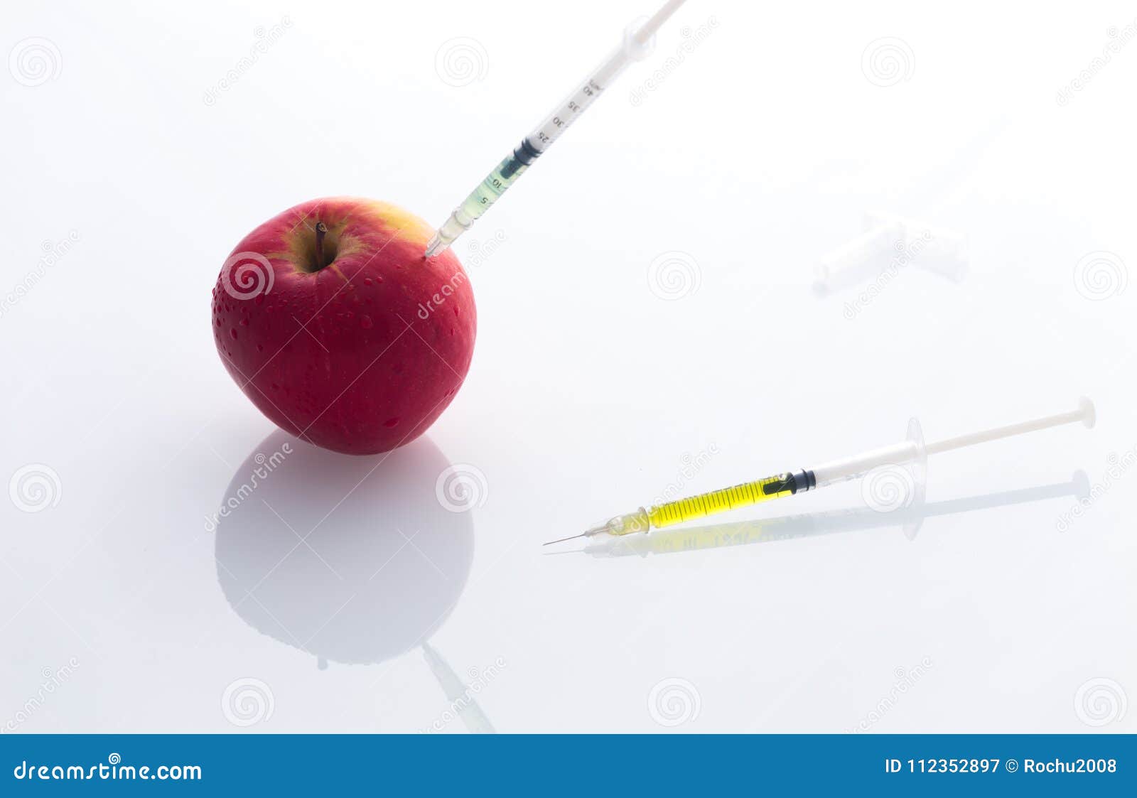 Apple with Punched Needles and Syringes As a Concept for Modifying Food ...