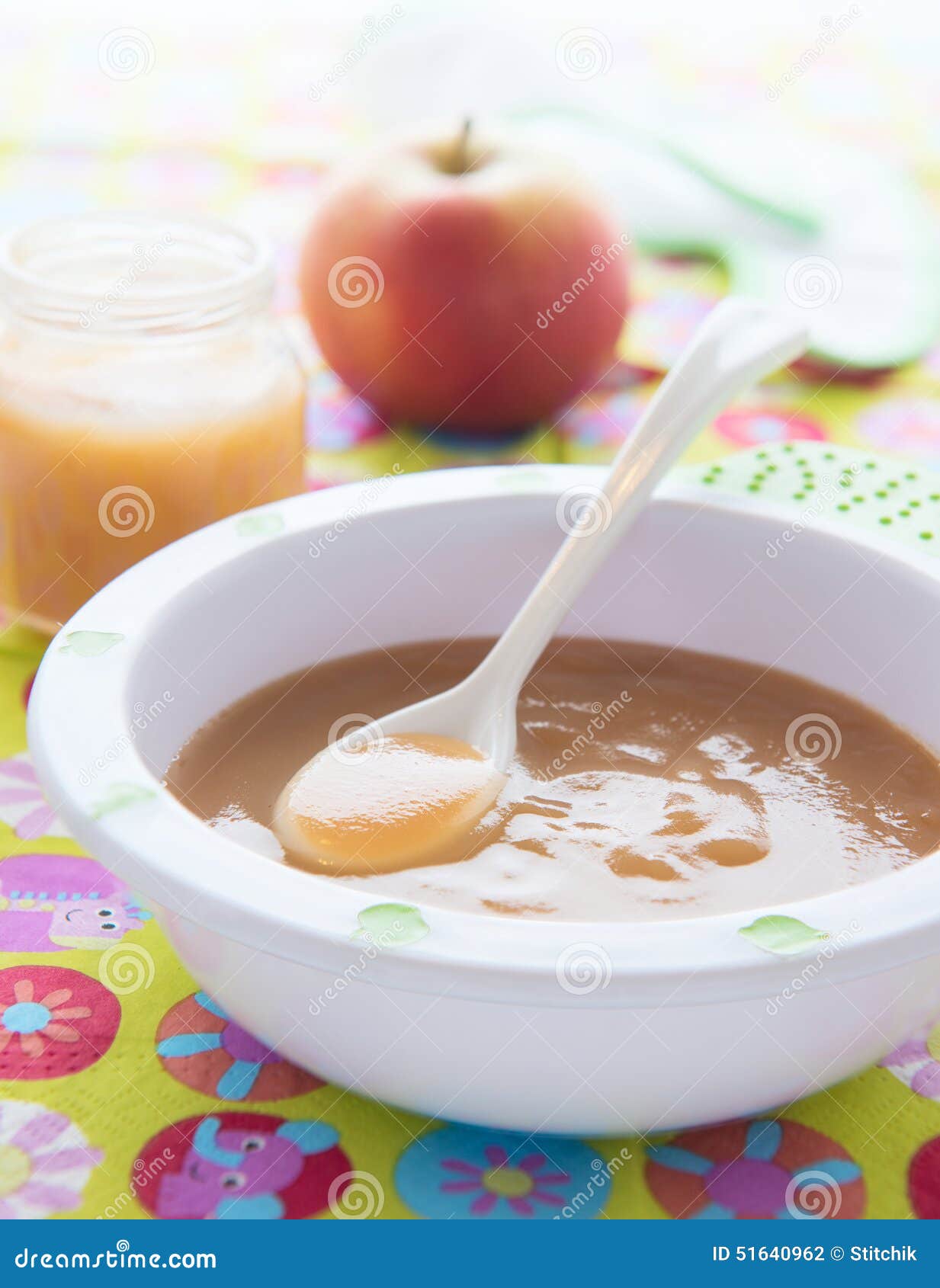 Apple Puree in Bowl with Spoon on Colorful Tablecloth Stock Photo ...