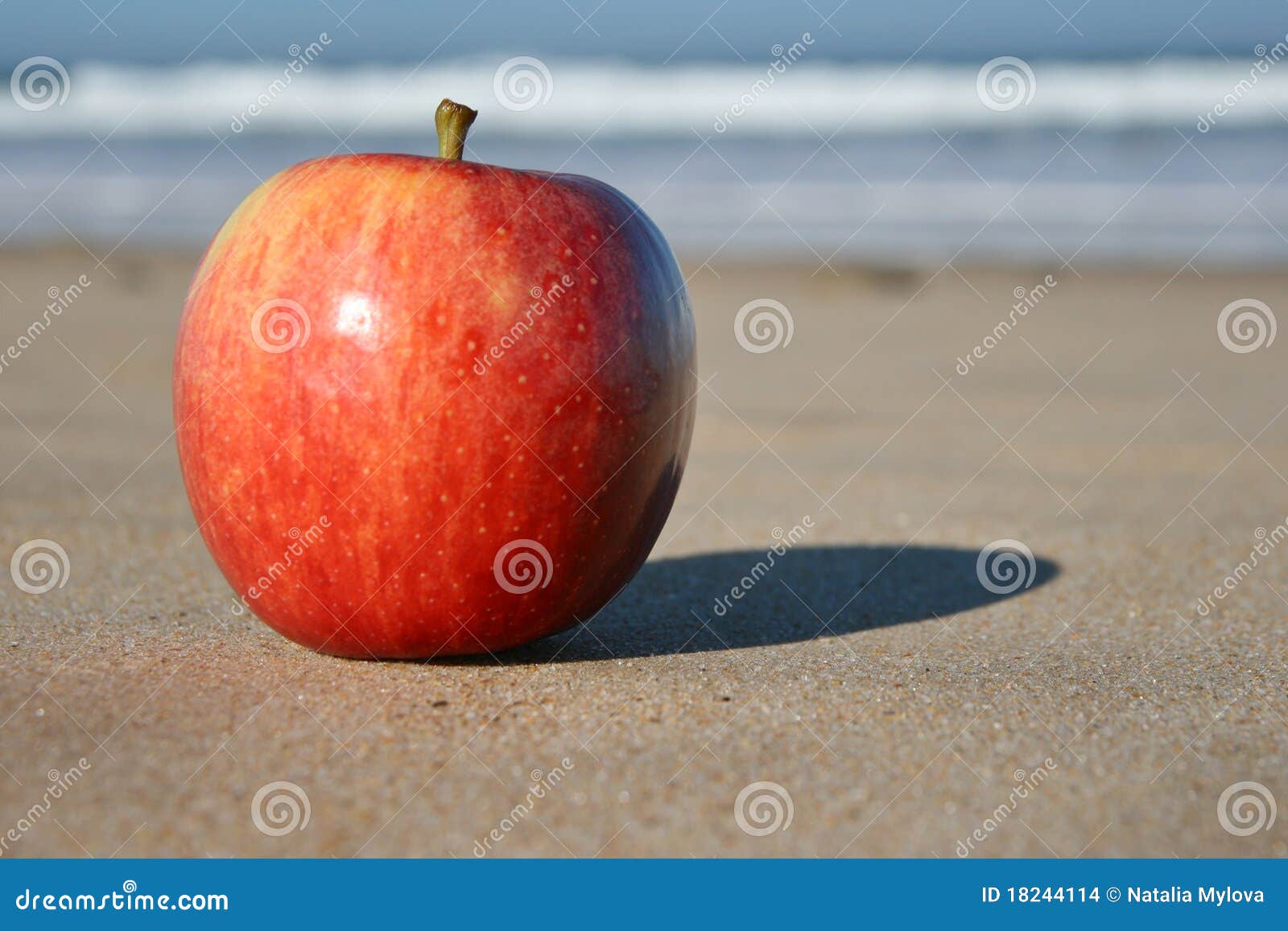Apple on sand stock photo. Image of sunlight, healthy - 18244114