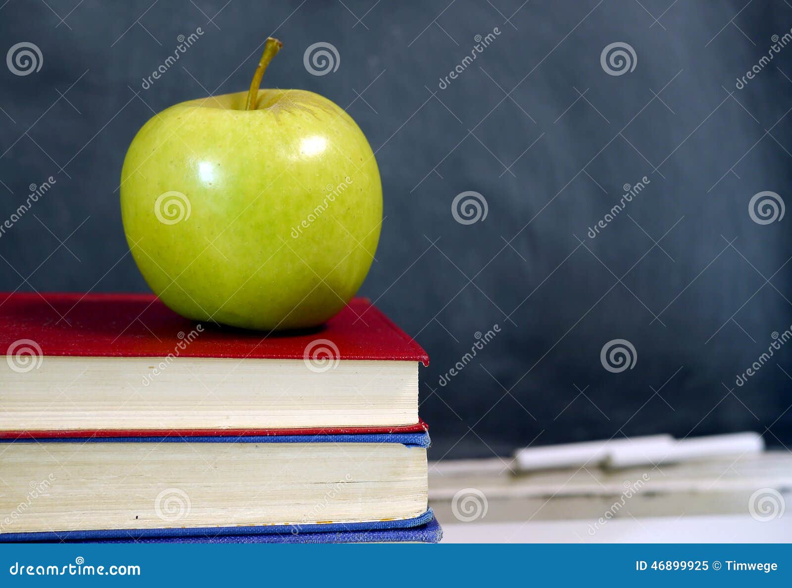 Apple on school textbook stock image. Image of textbook - 46899925