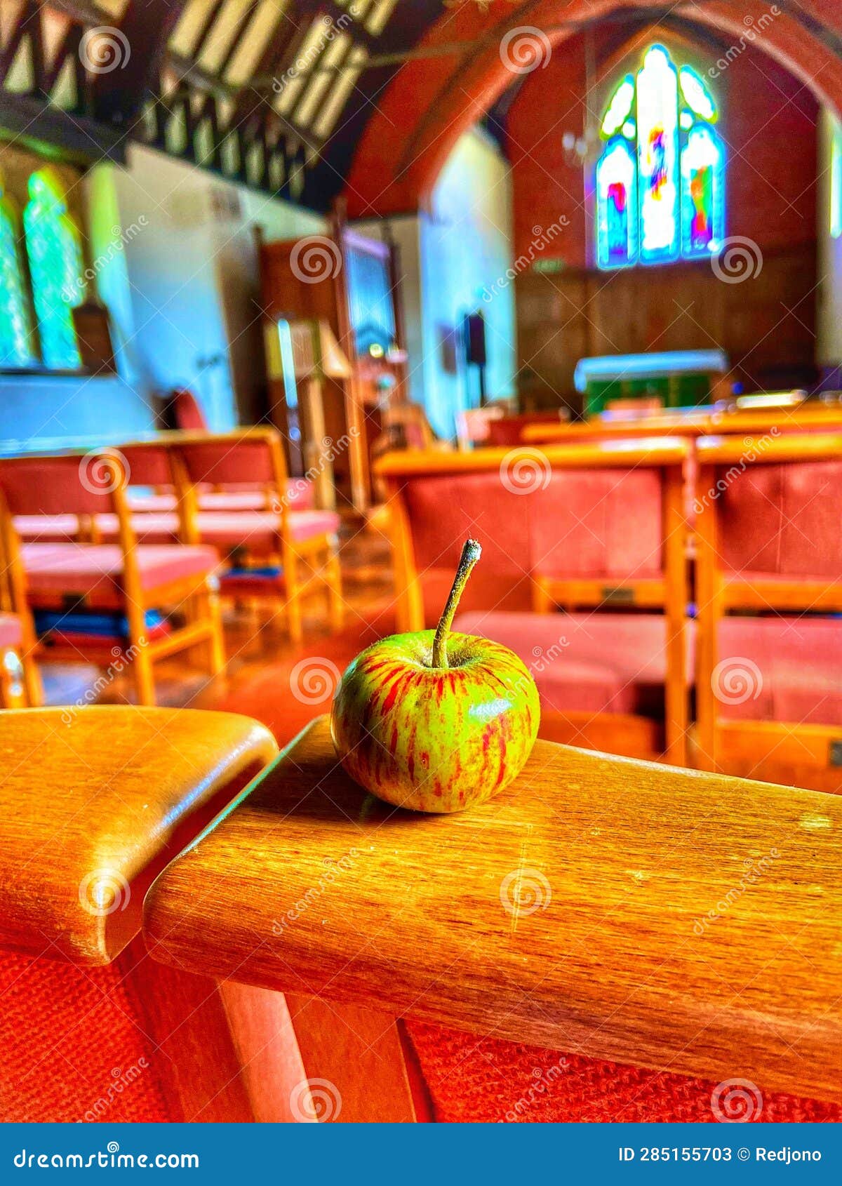 Apple Sitting on Bench in Chapel or Church Setting Stock Image - Image ...