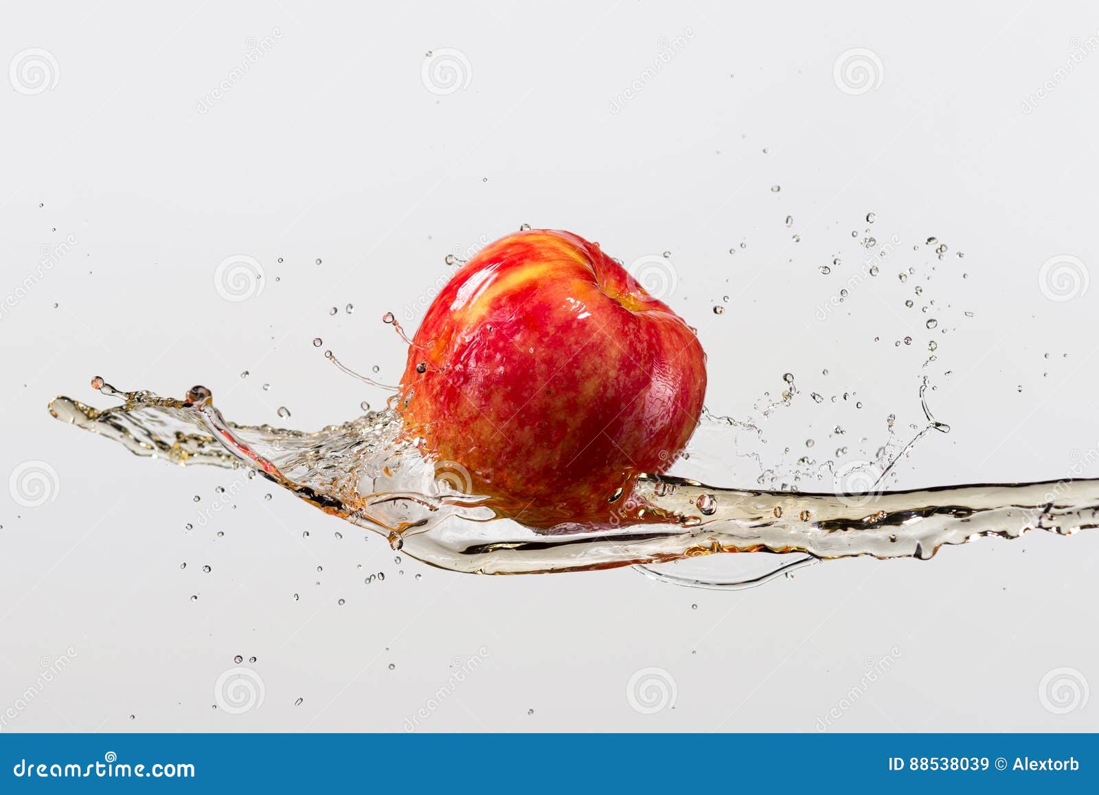 Apple and Splash of Juice Isolated on Gray Background Stock Image ...
