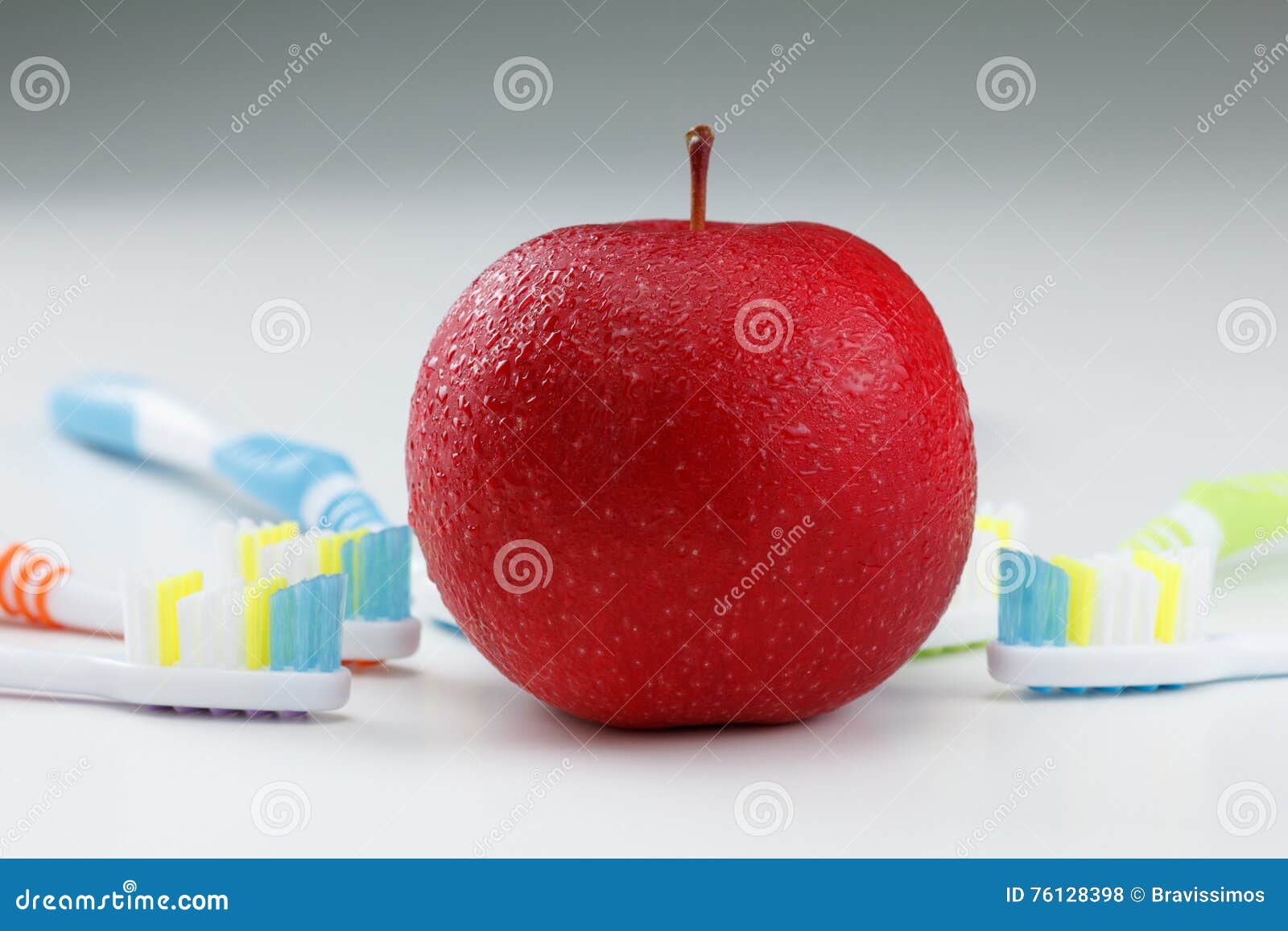 Apple with a toothbrush stock photo. Image of white, brush - 76128398