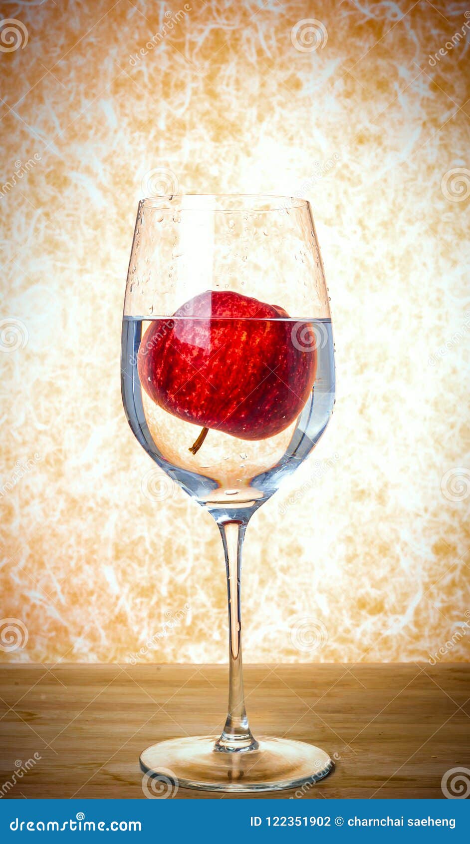 An Apple in Wine Glass with a Water. Stock Photo - Image of clean ...