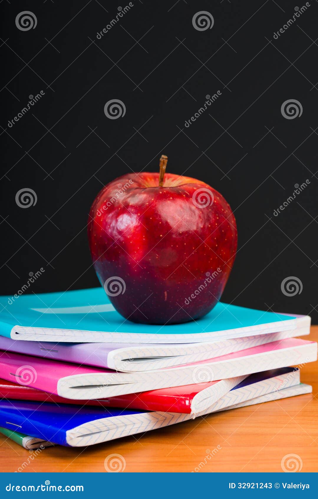 Apple on writing-books stock image. Image of back, supplies - 32921243