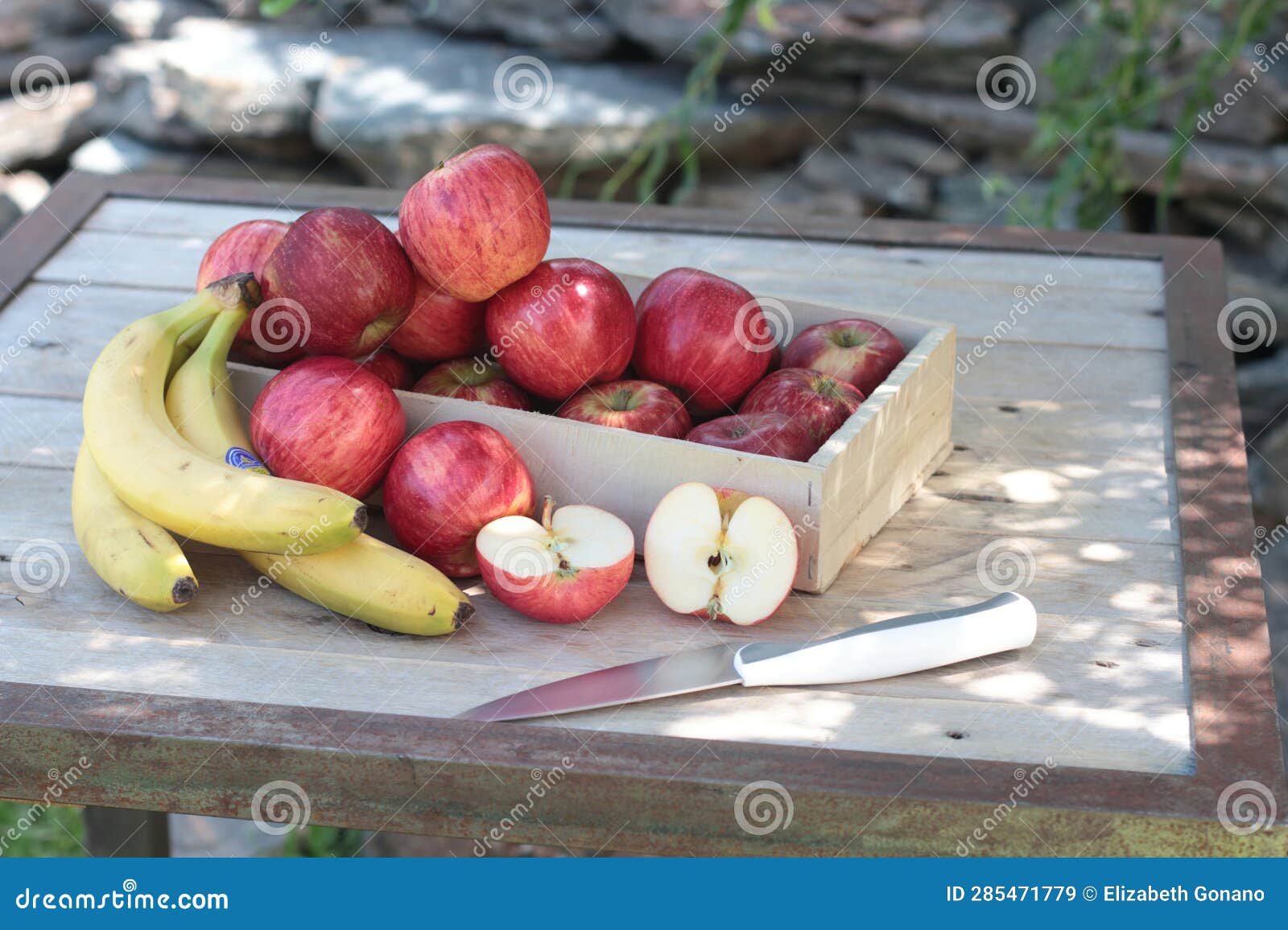 Apples and Bananas in a Box on a Table Stock Image - Image of ...