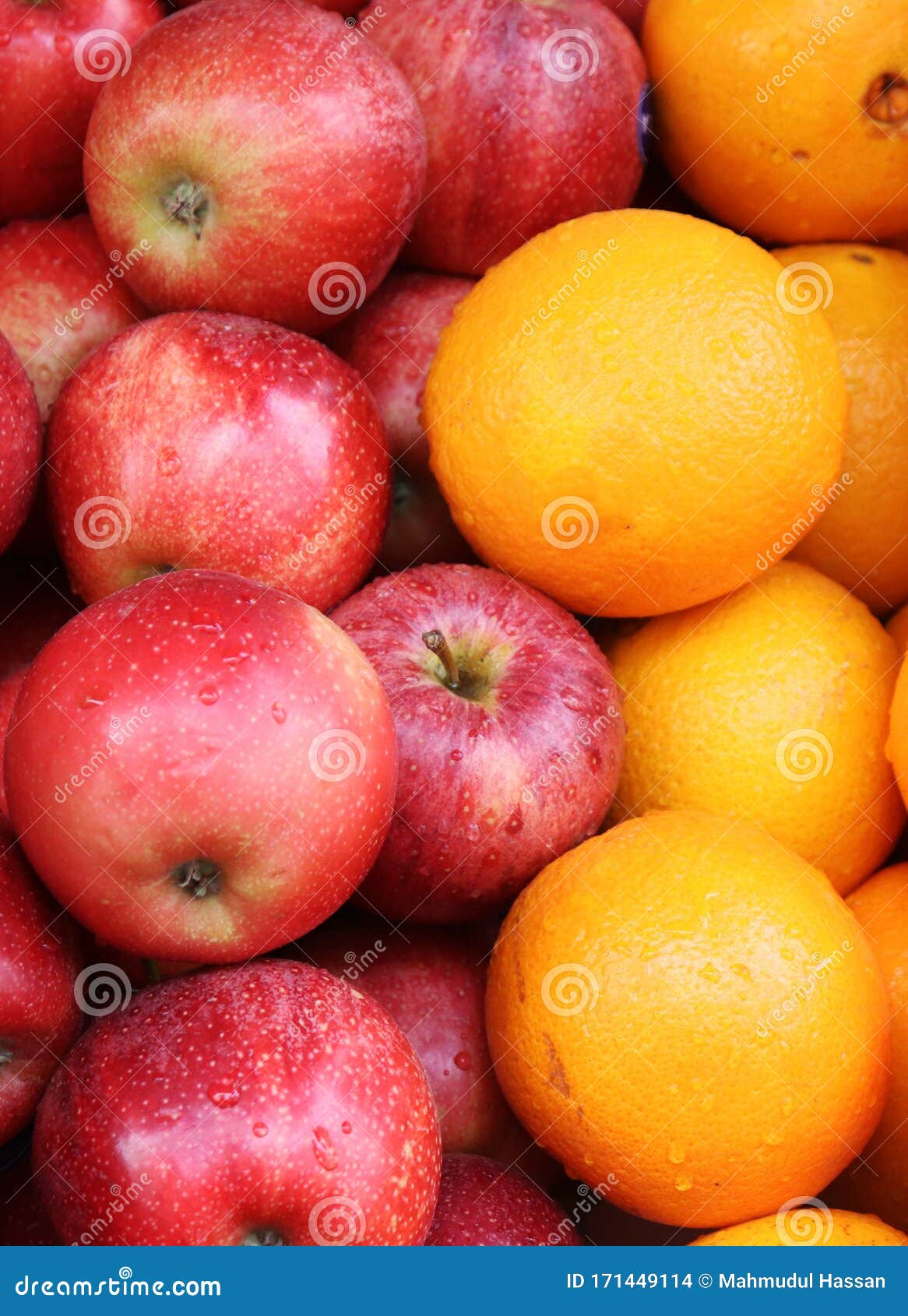 Apples and Orange in the Shop. Fresh Red Apples and Orange Stock Photo ...
