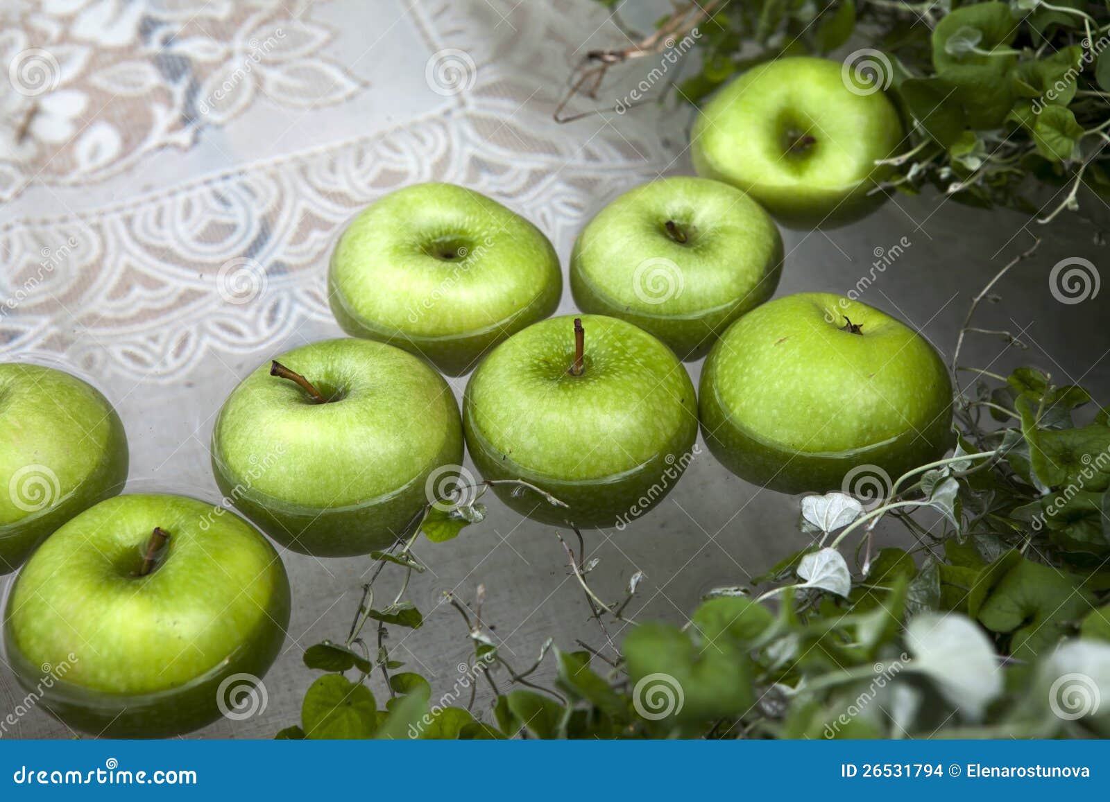 The apples sunked stock photo. Image of cool, color, buried - 26531794