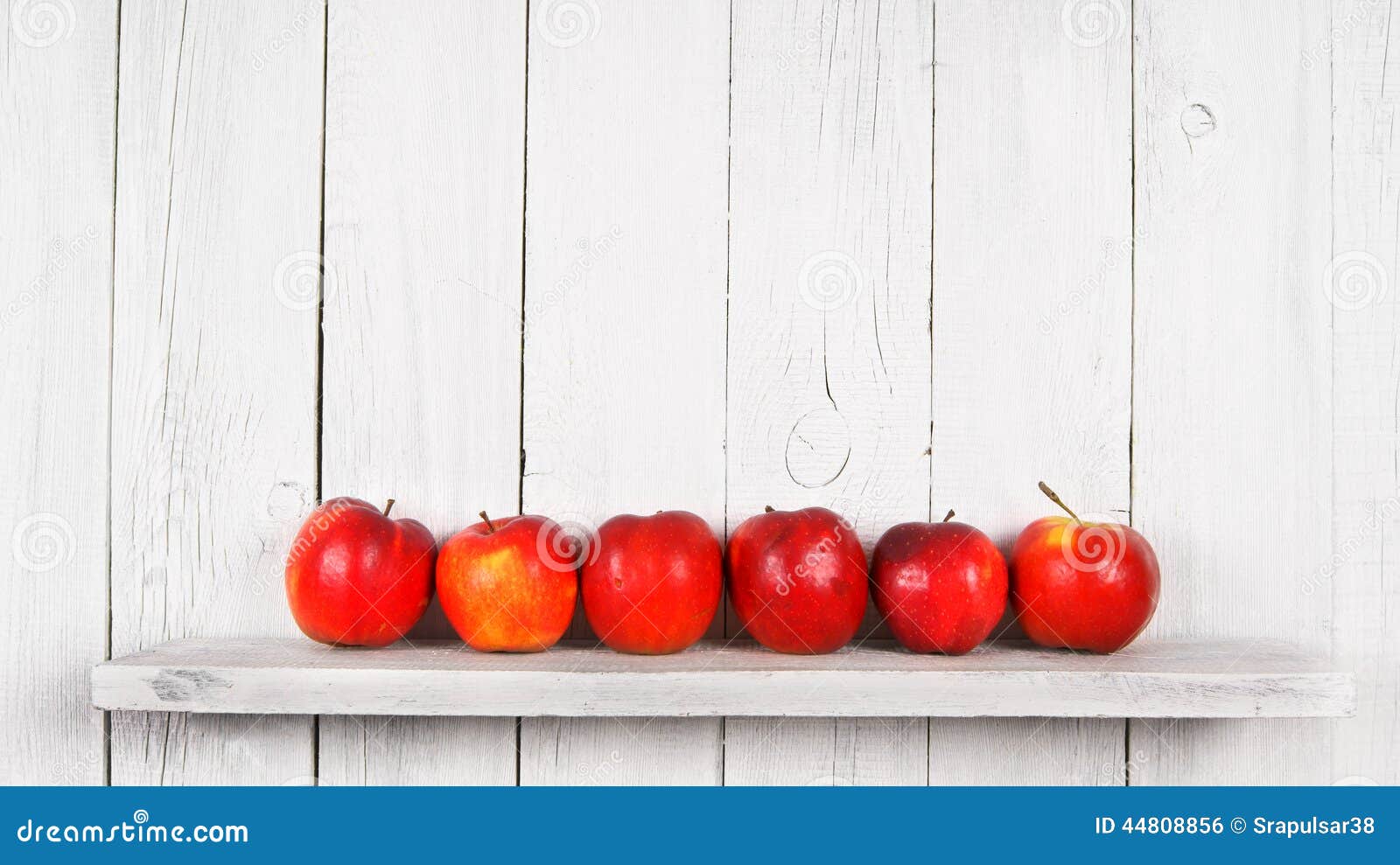Apples on a wooden shelf. stock photo. Image of macro - 44808856