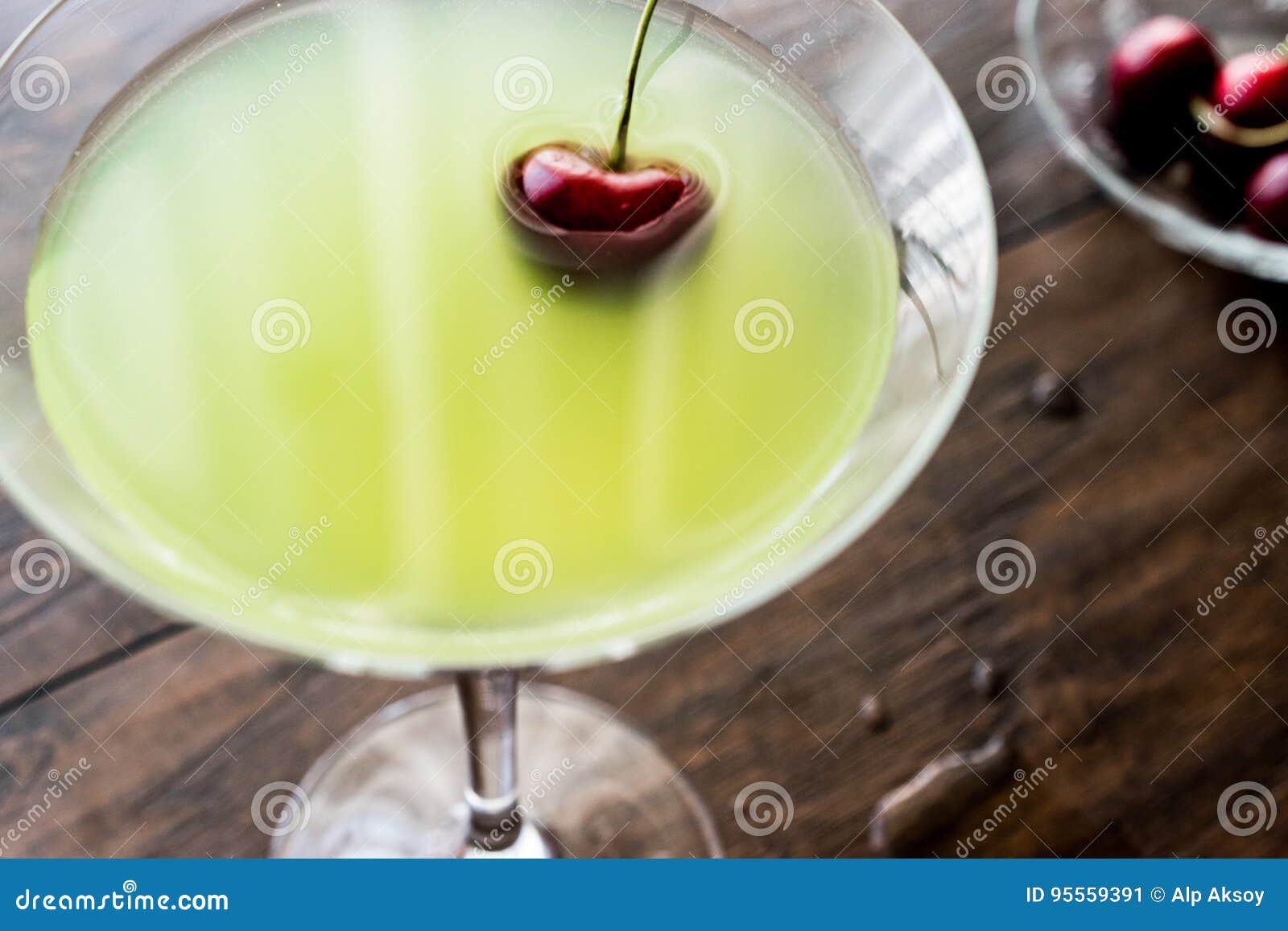 Appletini Cocktail with Cherry on Wooden Surface. Stock Image - Image ...