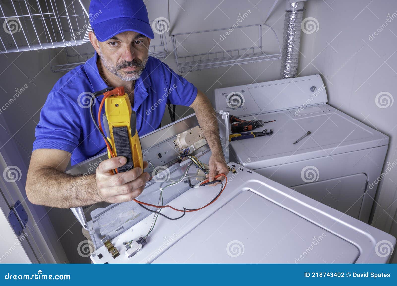 Appliance Technician Working on a Washing Machine Stock Photo - Image ...