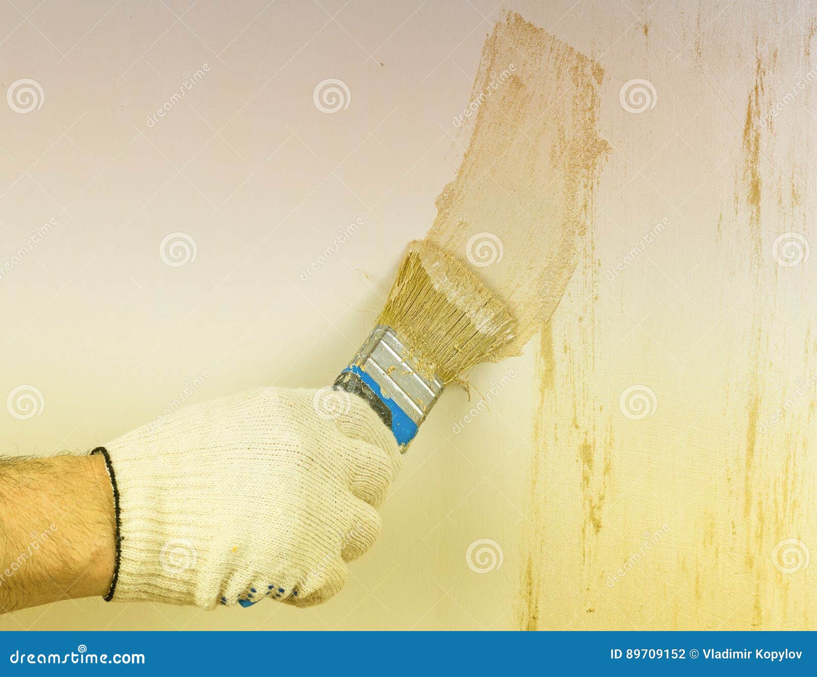 The Application of Decorative Paint on the Wall in the Sun. Stock Photo ...