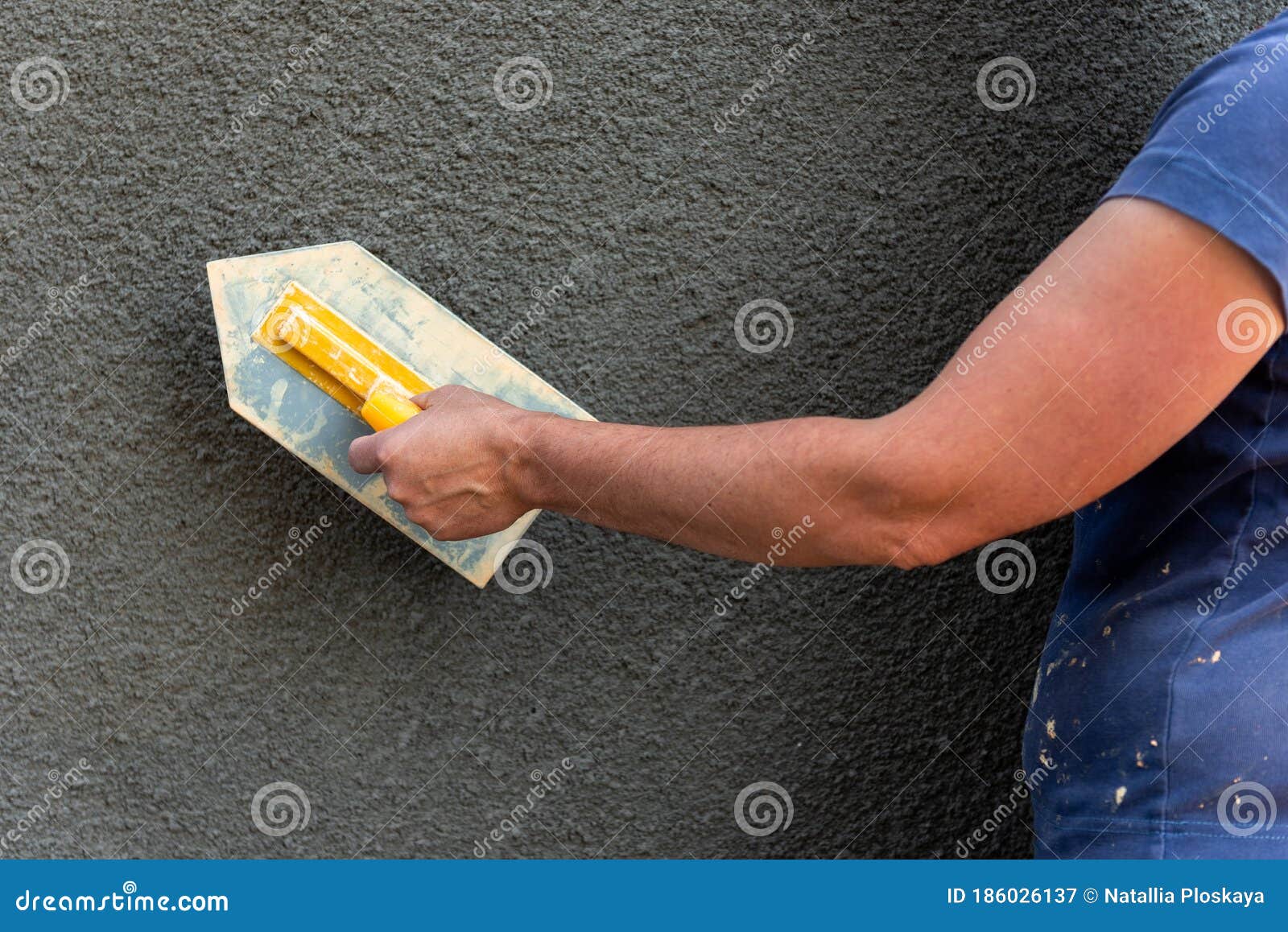 Application of Decorative Plaster on Wall Using Construction Tool Stock ...