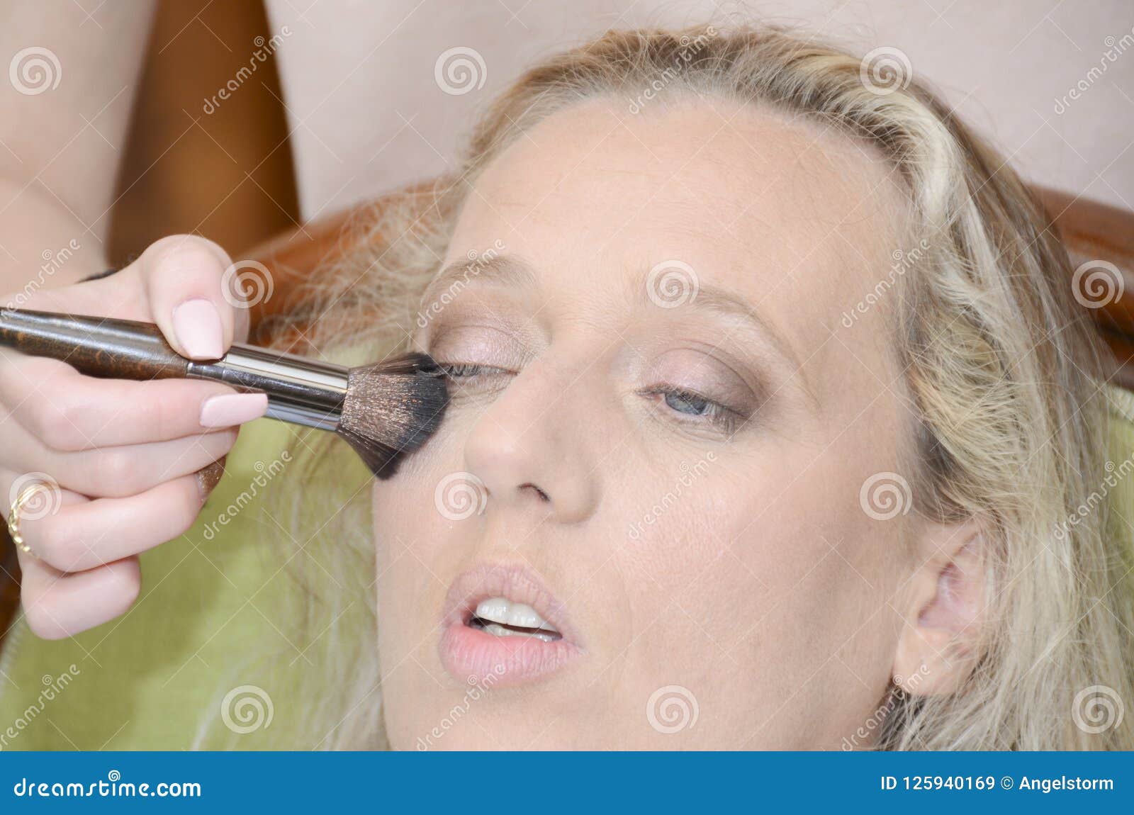 Application of Face Powder on the Face of a Pretty Woman Stock Image ...