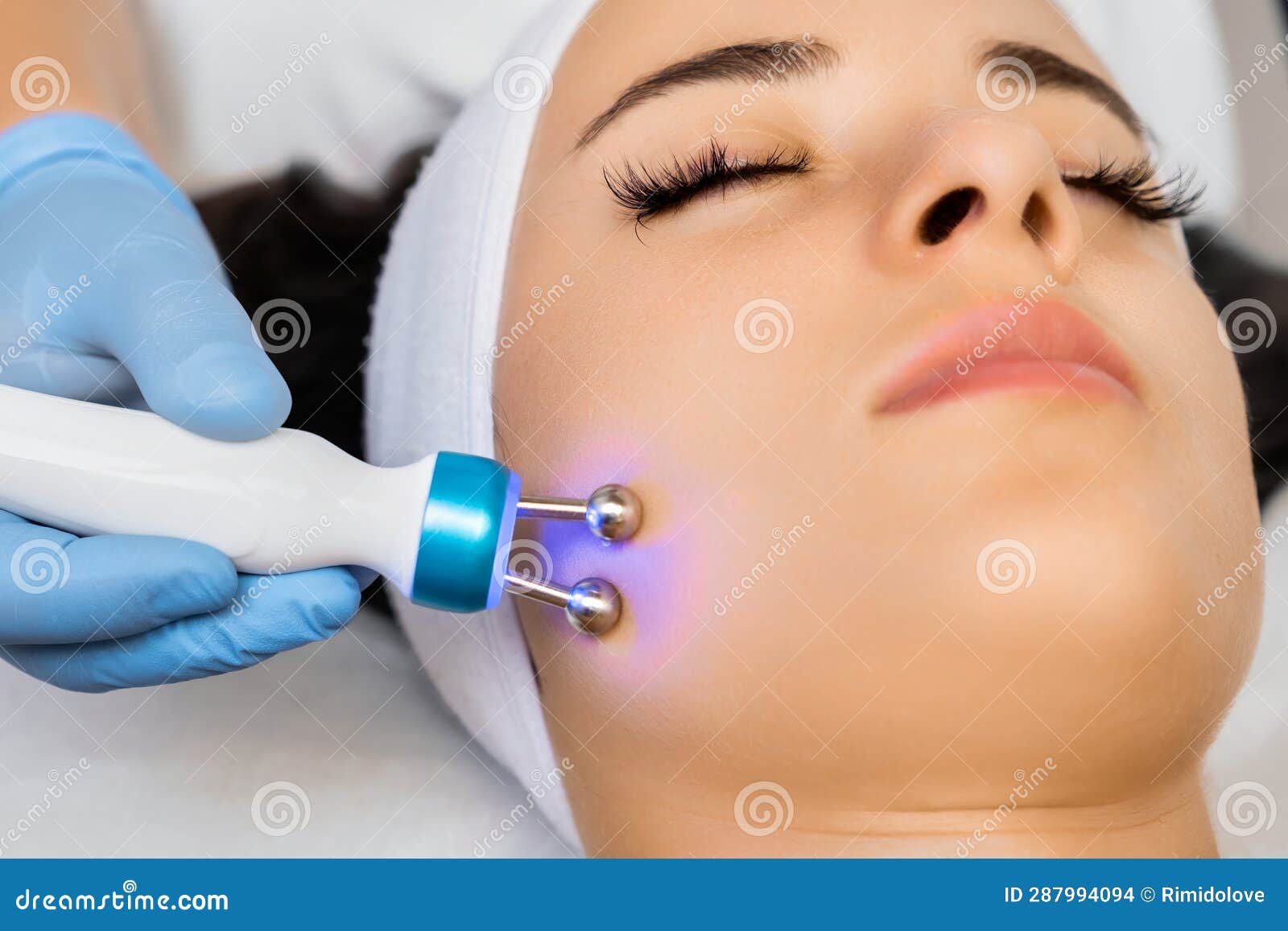 Application of Microcurrent Massage Device on Female Face Stock Photo ...