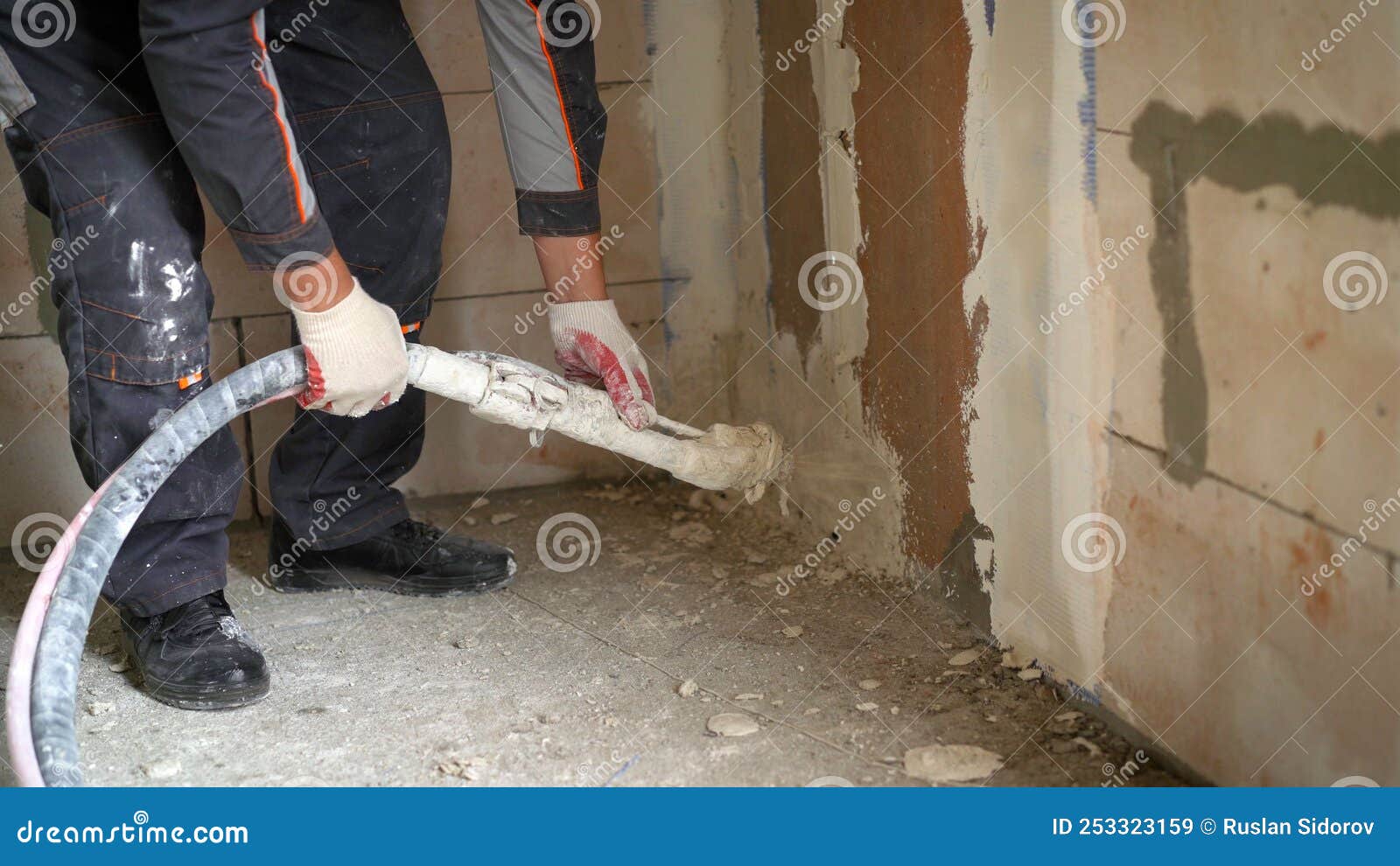 Machine Application Of Plaster To The Wall. Plasterer Throws Plaster On ...