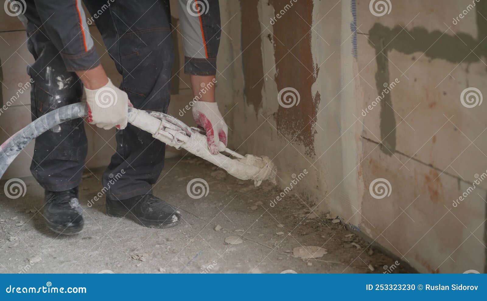 The Plaster is Applied with a Hose. Automatic Plastering Process ...