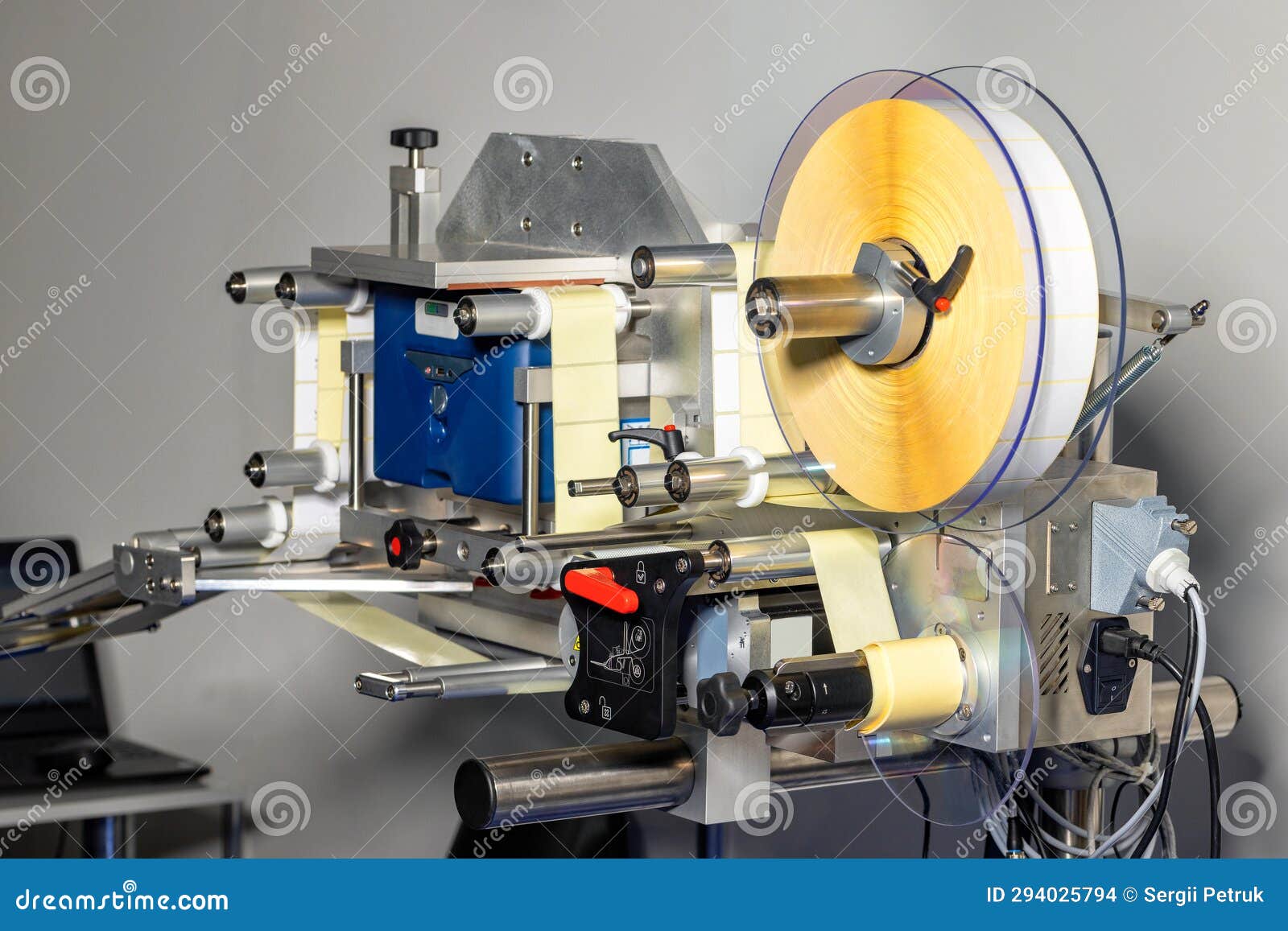 Applicator of Self-adhesive Labels in a Drum Roll Stock Photo - Image ...