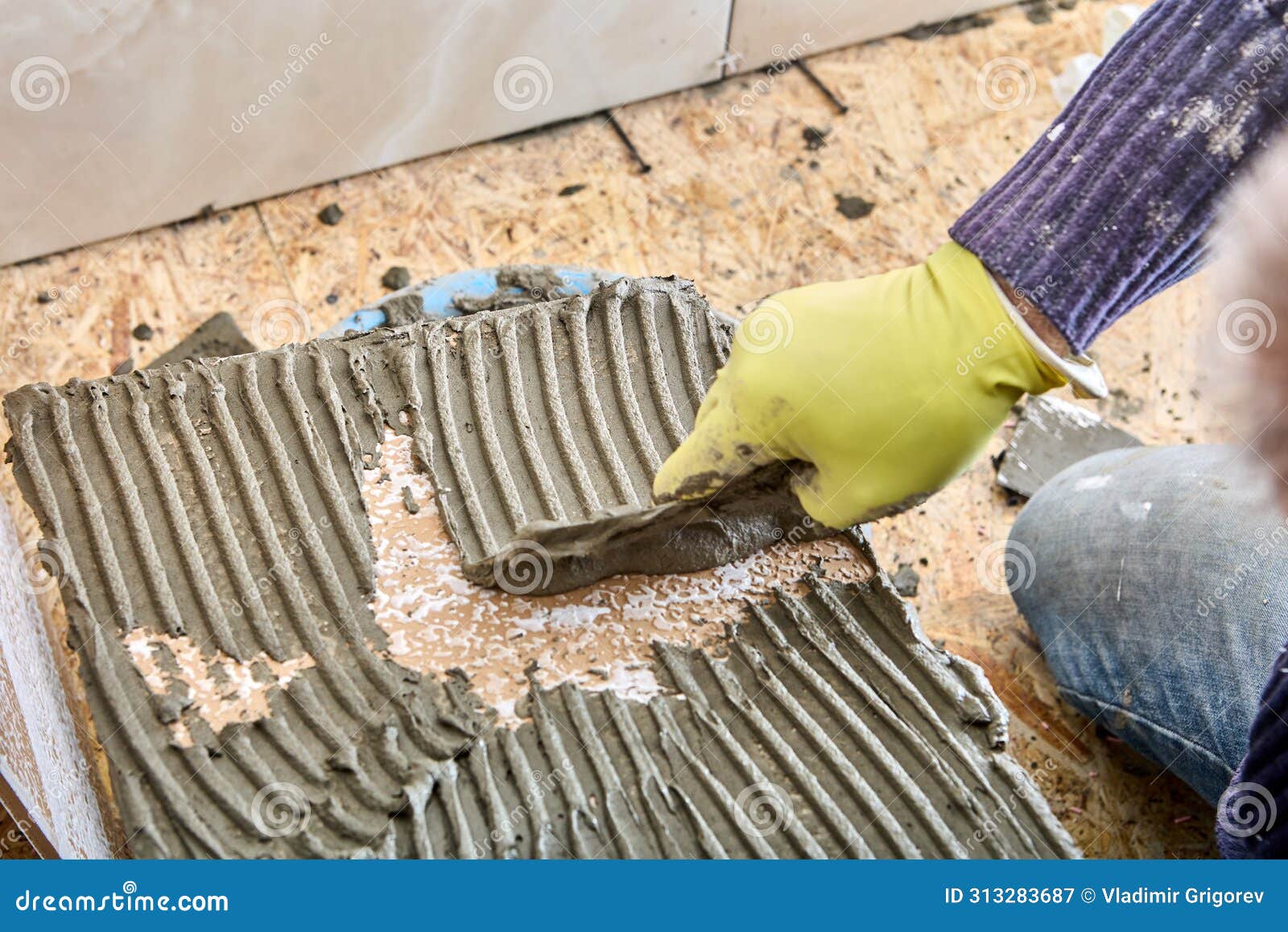 Applying Adhesive Cement Mortar To Back Side of Tiles Using Comb Trowel ...