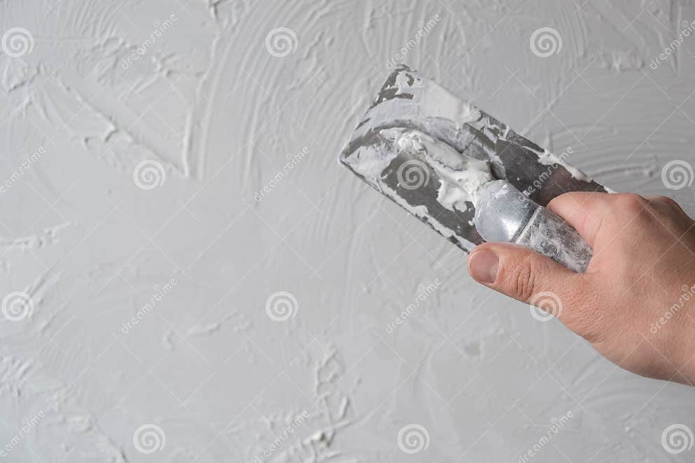 Applying Decorative Putty. White Abstract Texture of Surface Covered ...