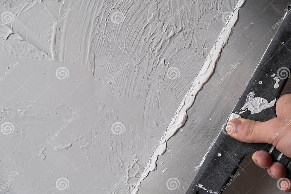 Applying Decorative Putty. White Abstract Texture of Surface Covered ...