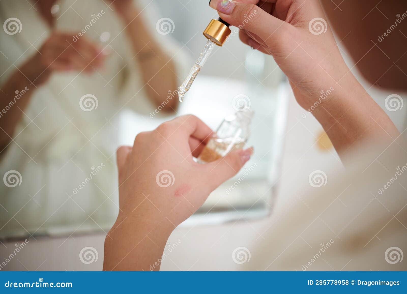 Applying Face Serum stock photo. Image of serum, cream - 285778958