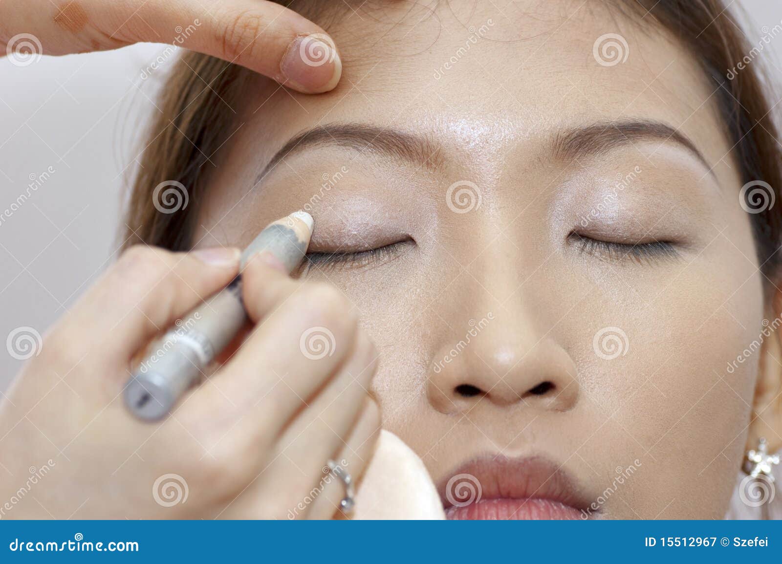 Applying makeup stock image. Image of closed, candid - 15512967