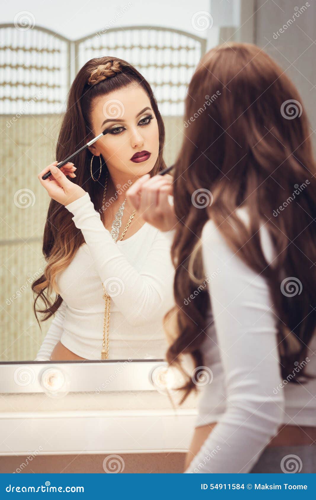 Applying makeup stock photo. Image of mirror, eyeliner - 54911584