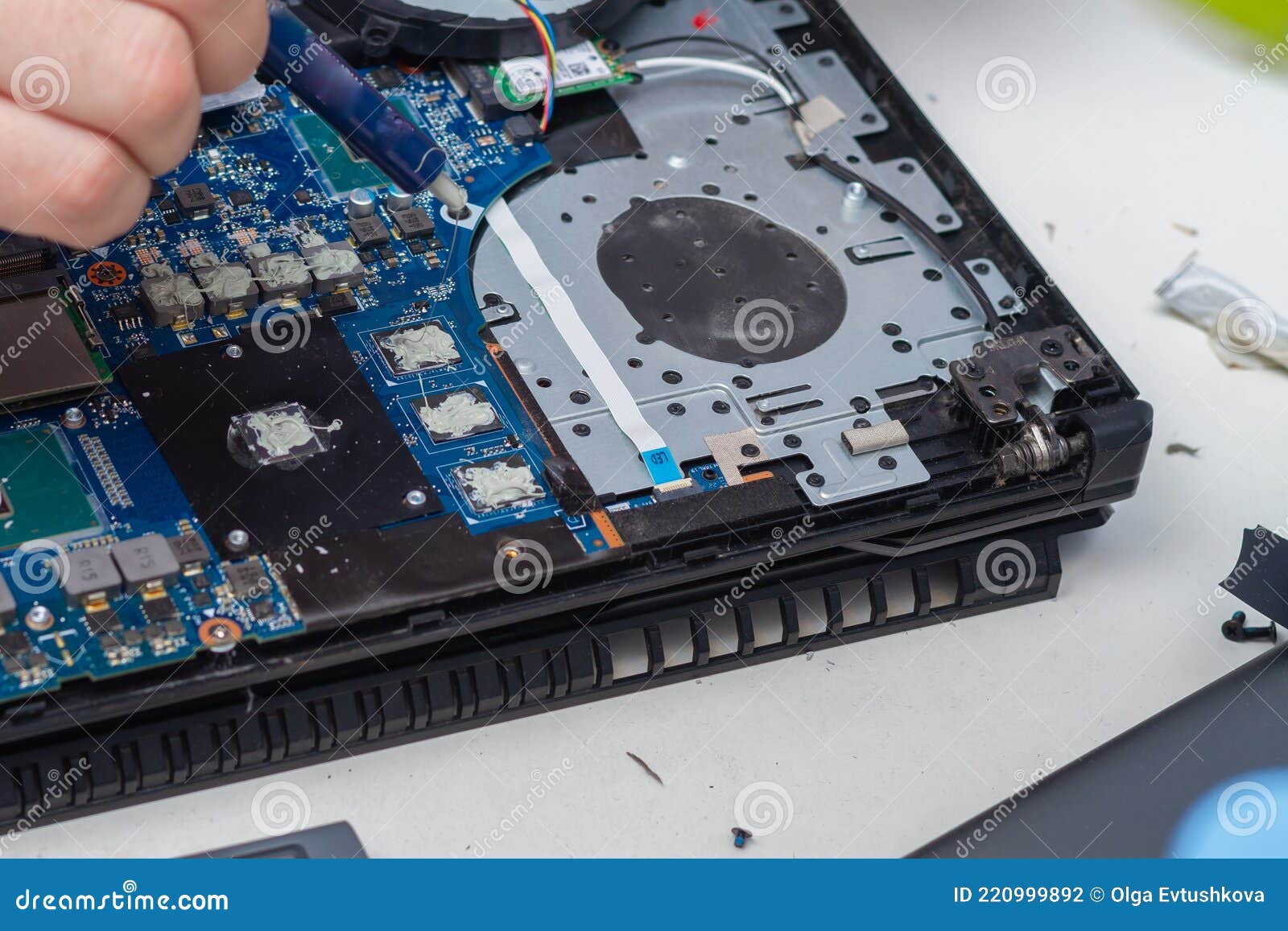 Applying a New Thermal Paste To the Laptop Cooling System from a Tube ...