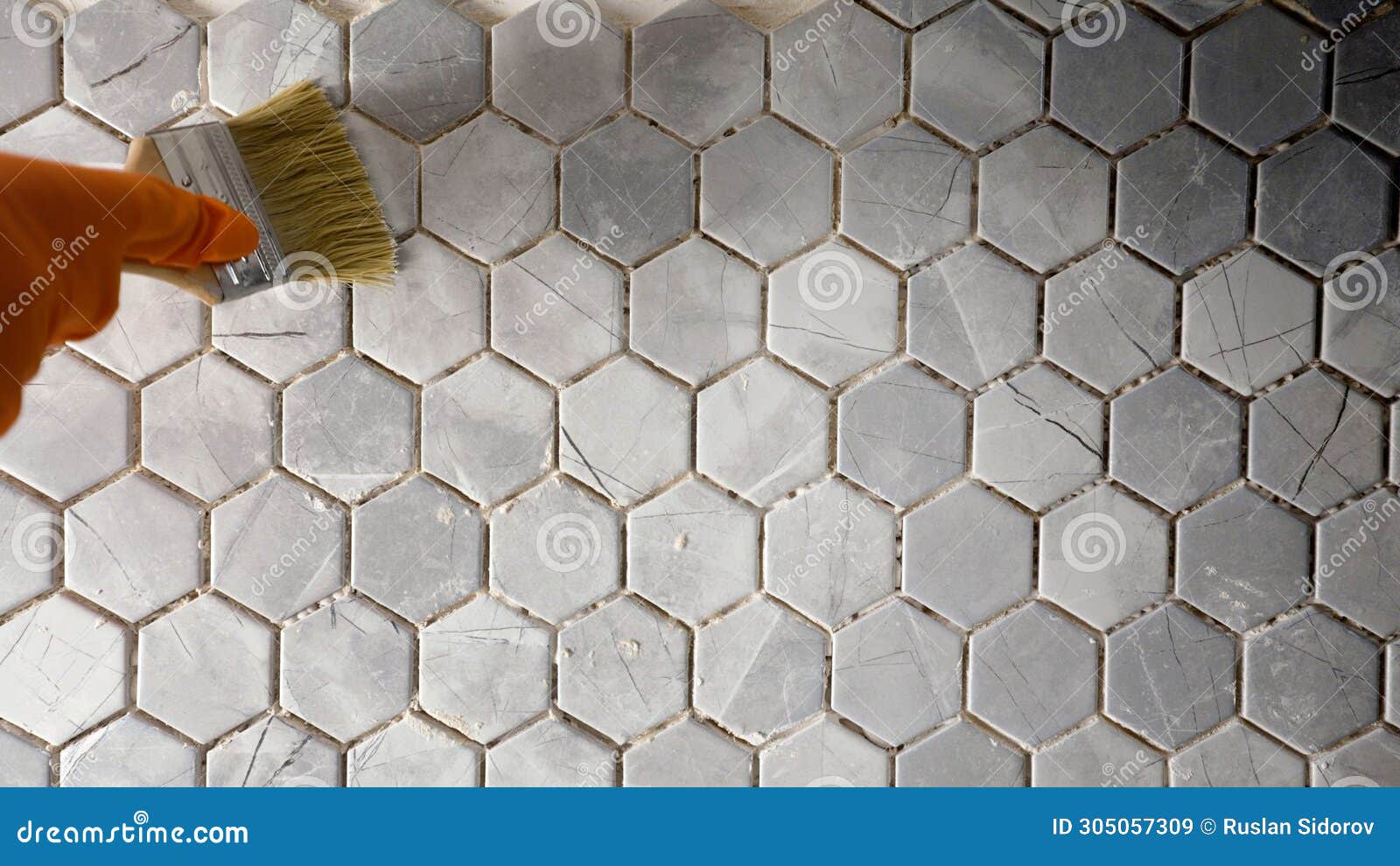 Repair Work Carried Out by a Ceramic Tile Specialist. Applying a ...