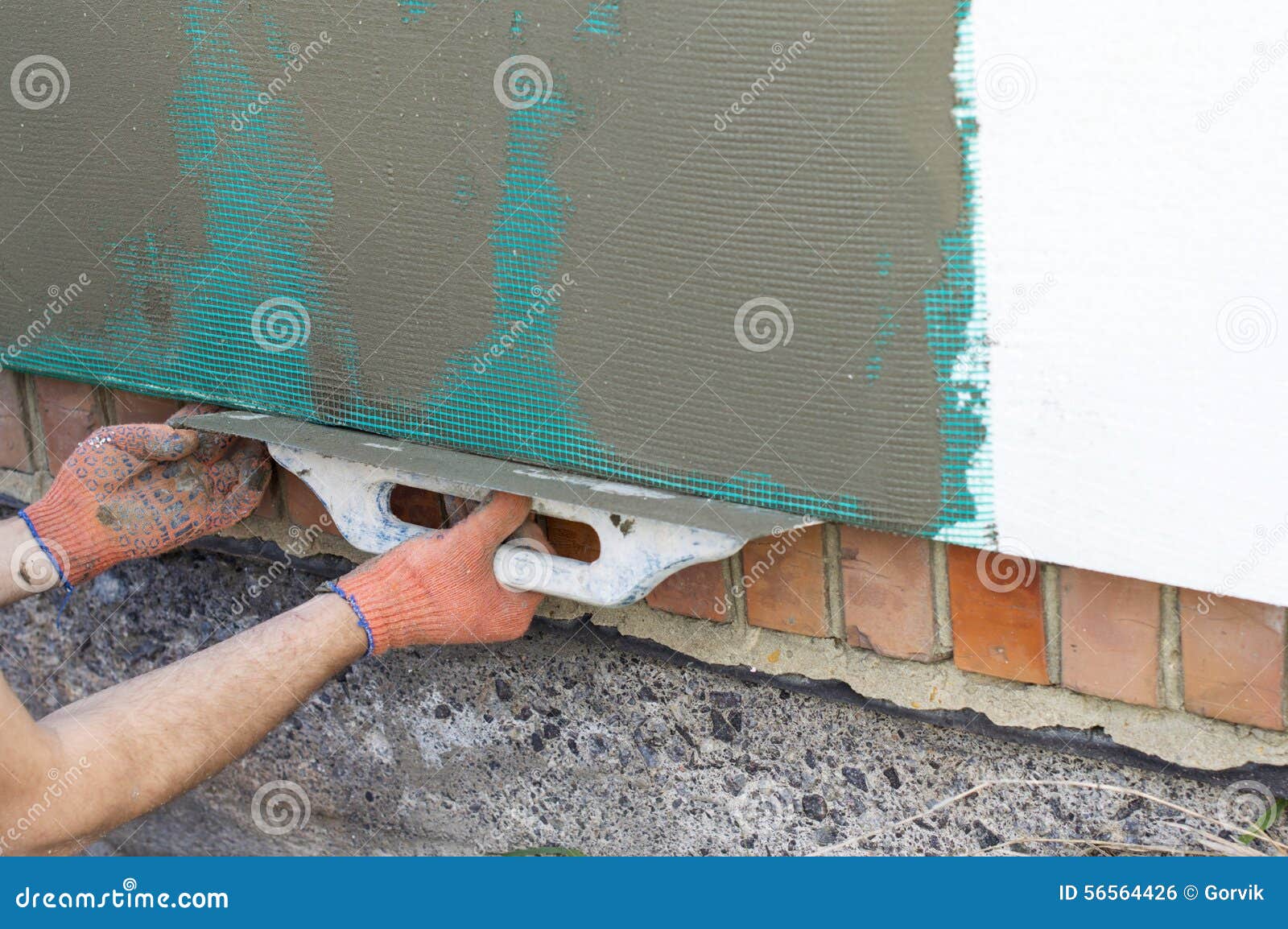 Applying Putty To the Wall Using a Spatula Stock Photo - Image of ...