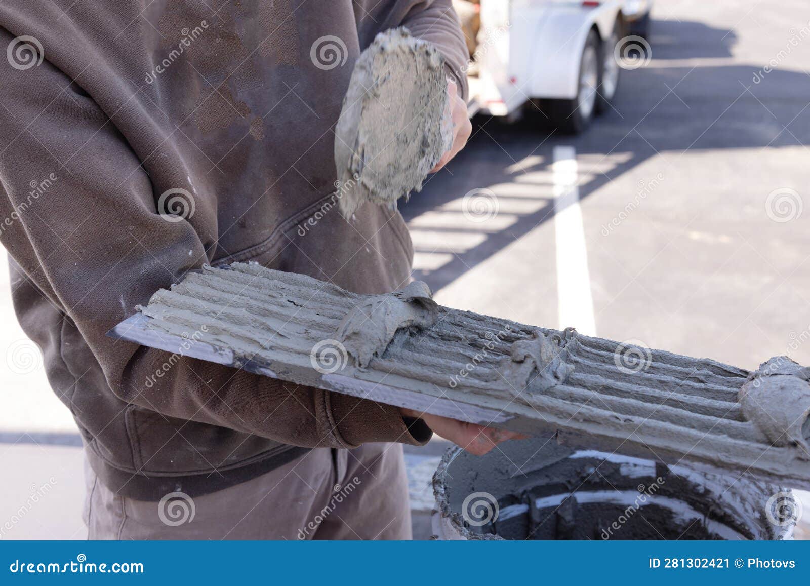 Applying Spreading Wet Cement Adhesive before Applying Tiles ...