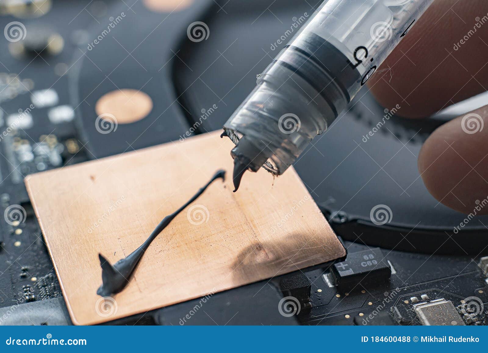 A Applying the Thermal Grease To the Gpu Chip for Better Heat ...