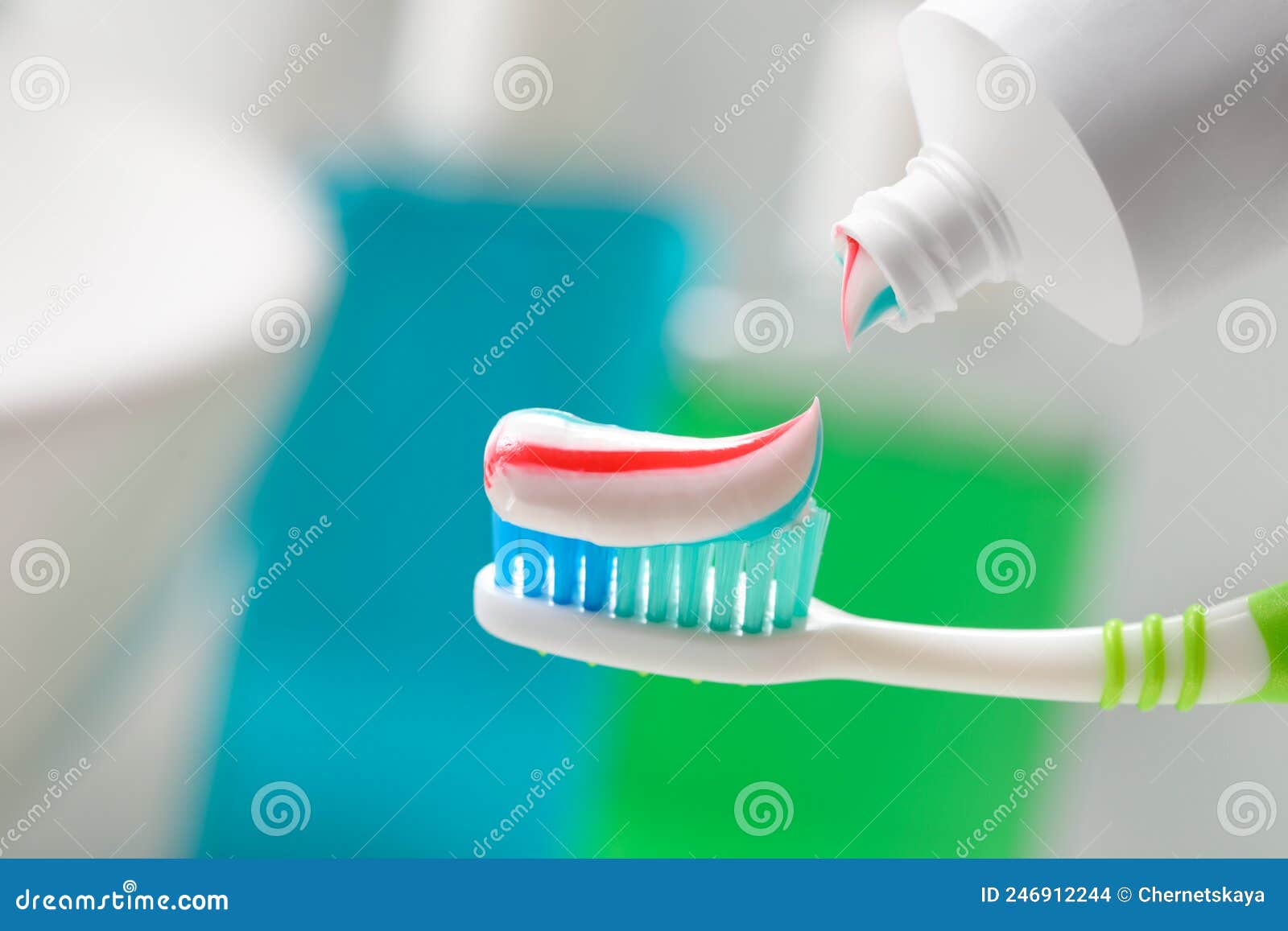 Applying Toothpaste on Brush Against Blurred Background, Closeup Stock ...