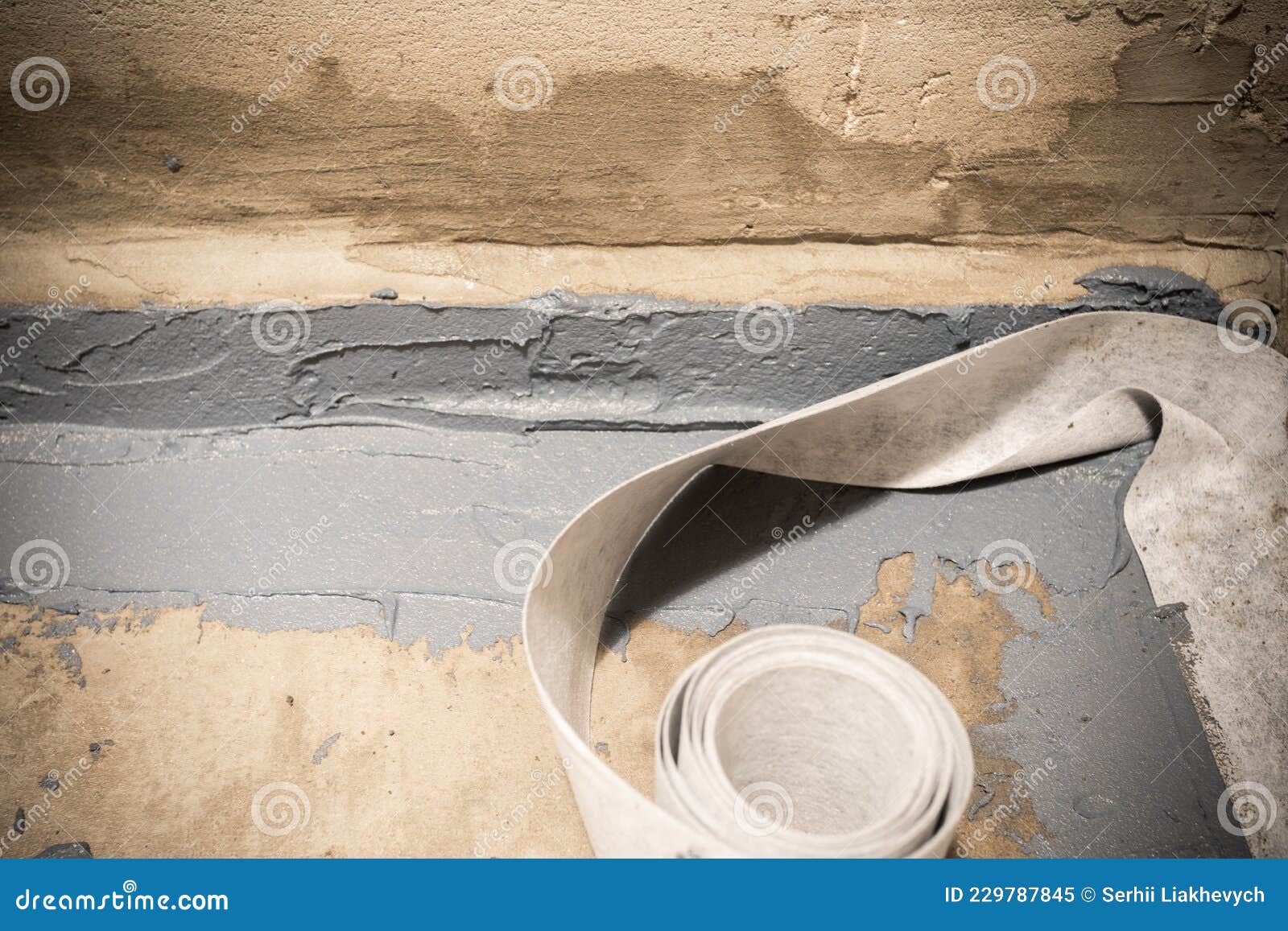 Applying a Waterproofing Tape To the Joint between the Wall and the ...