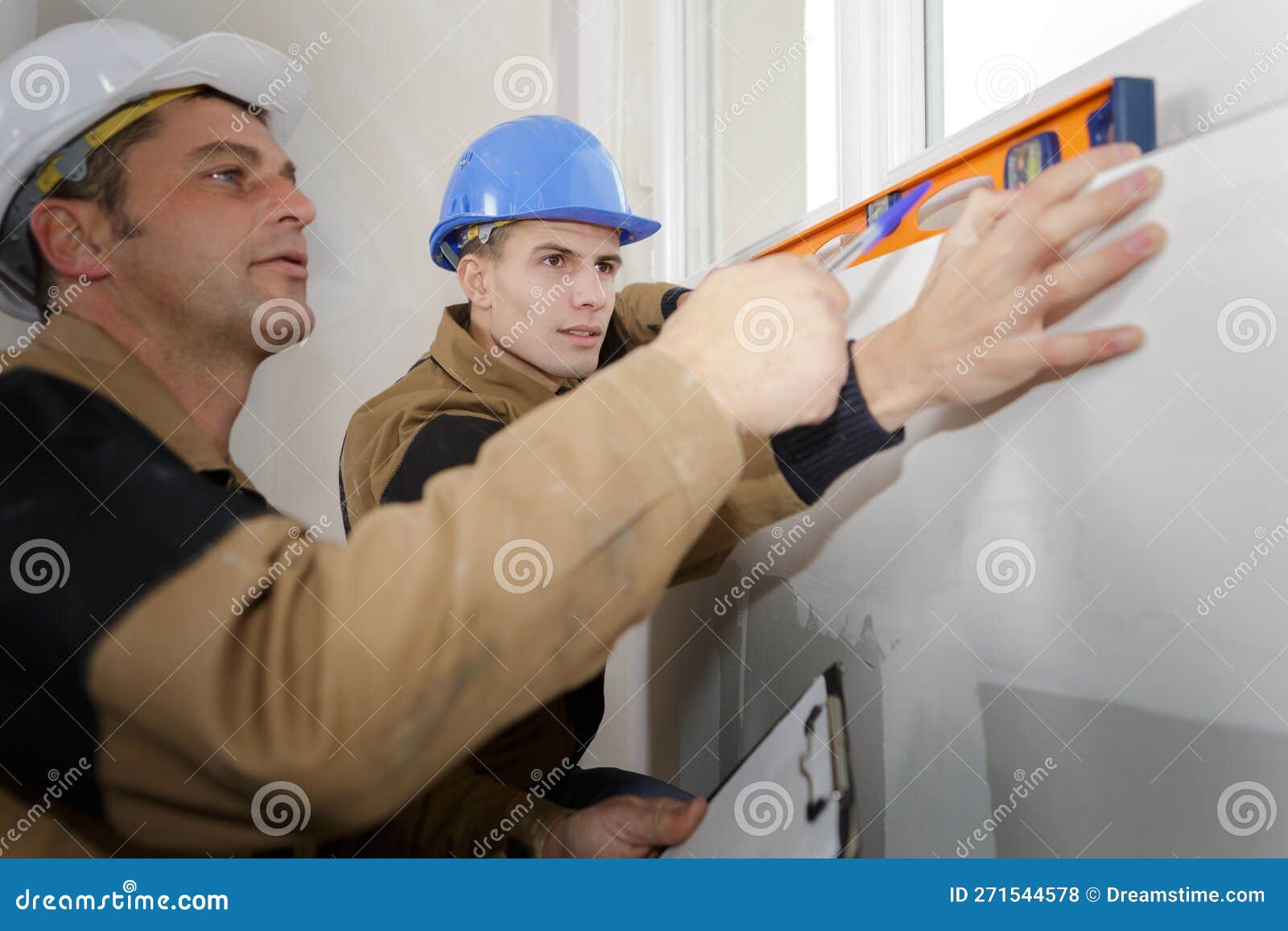 Apprentice Being Guided To Use Spirit Level Stock Photo - Image of ...