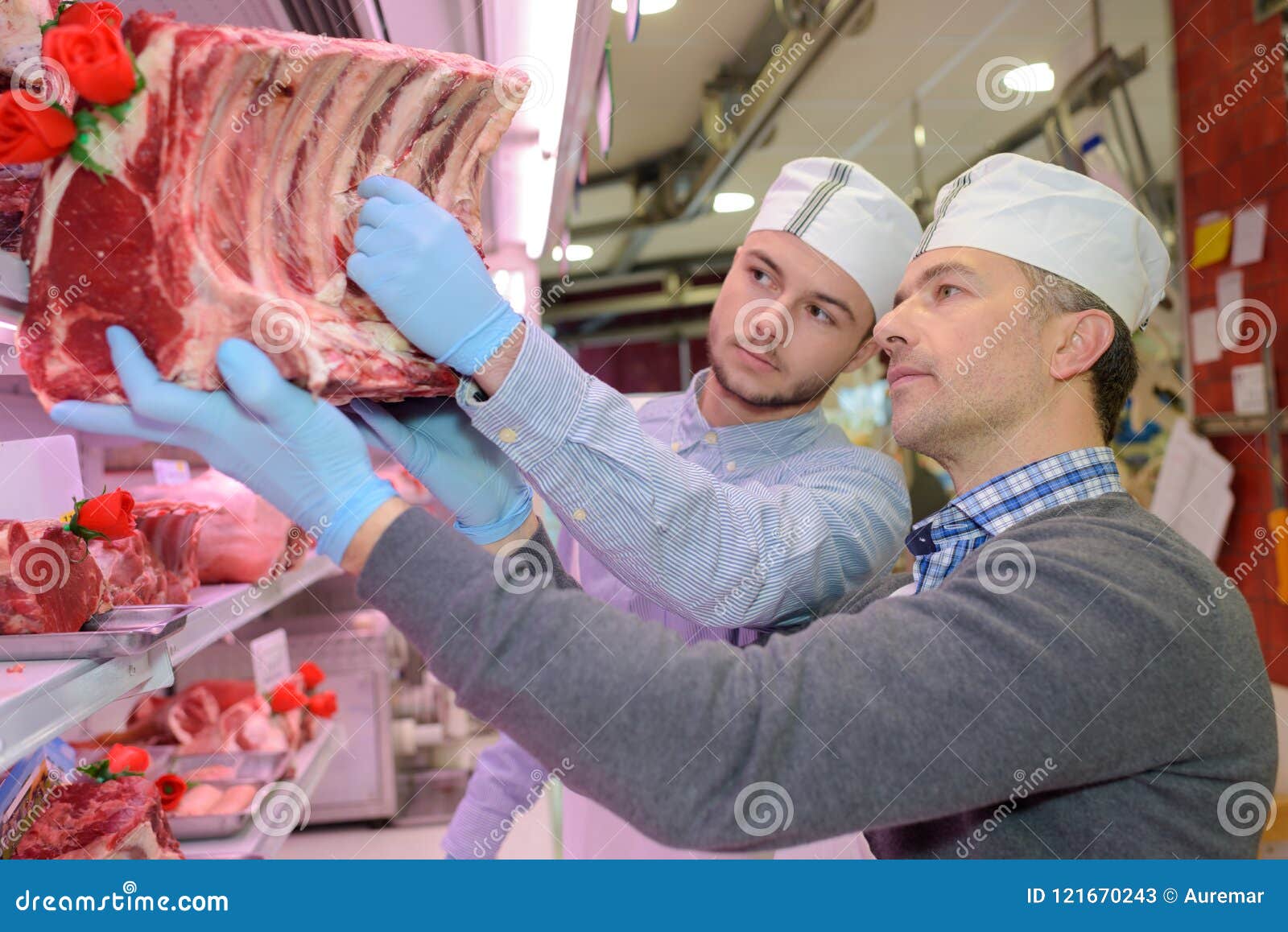 Apprentice of a butcher stock image. Image of sharing - 121670243