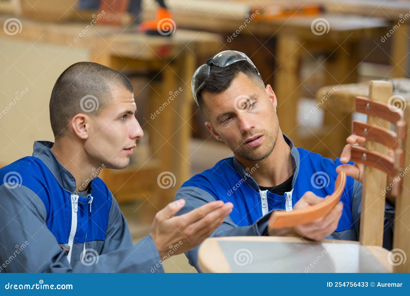 Apprentice Carpenter Working on Chair with Foreman Stock Image - Image ...