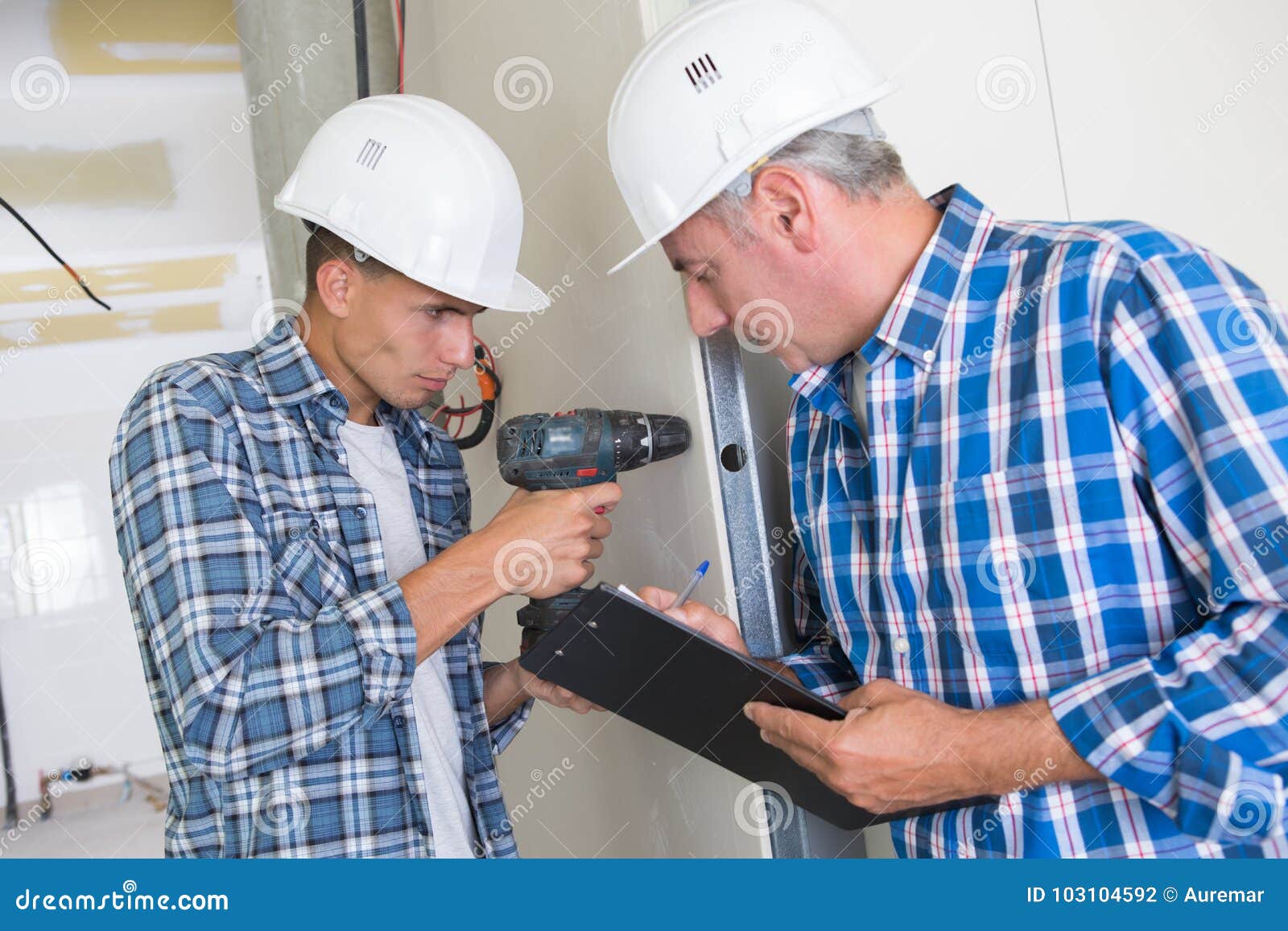 Apprentice Construction Worker Drilling Wall Stock Photo - Image of ...